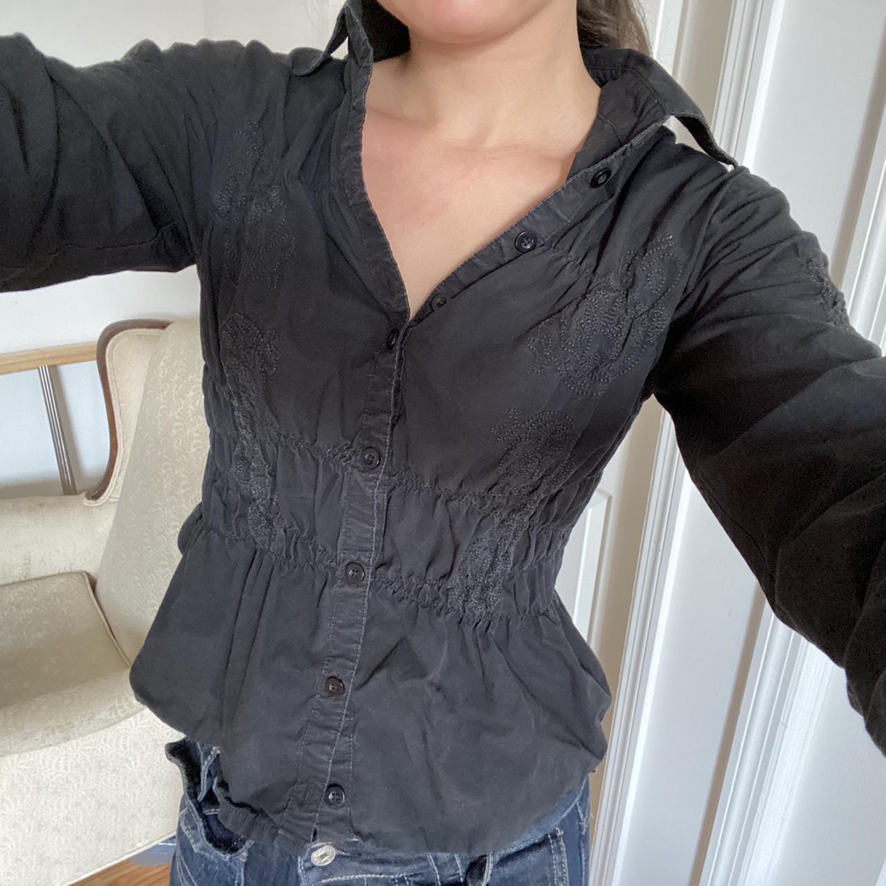 Flattering cinched black button up top. Not cop... - Depop