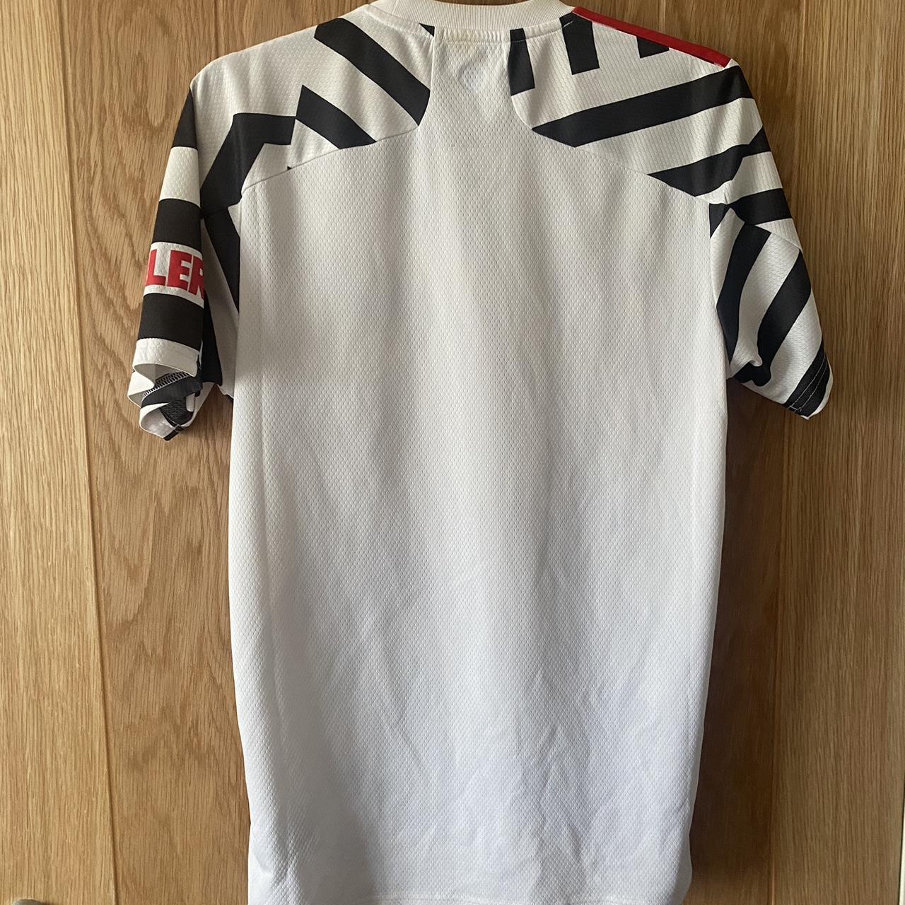 Manchester United Zebra away shirt hardly worn like... - Depop