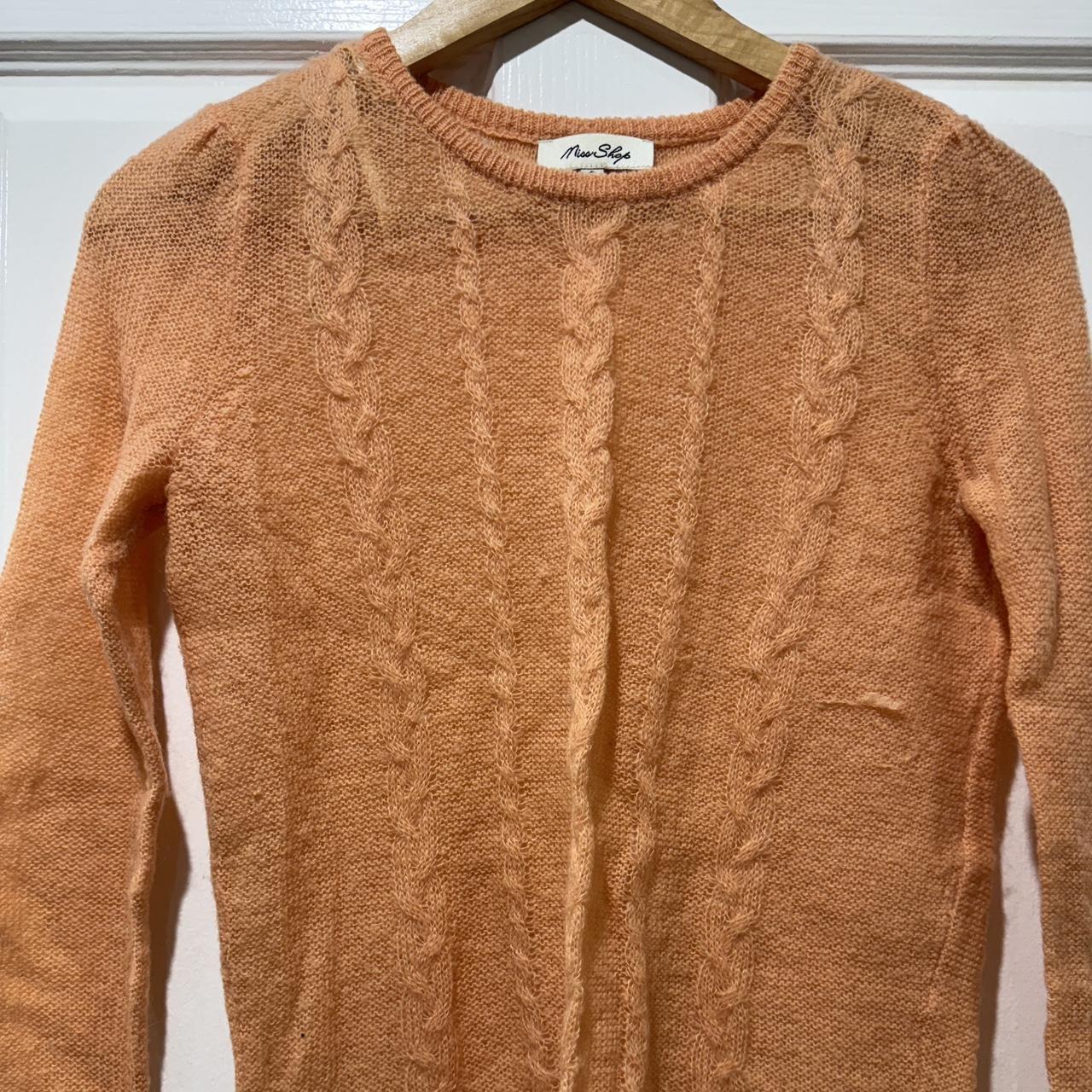 Sheer tangerine cable knit sweater has one small... | Depop
