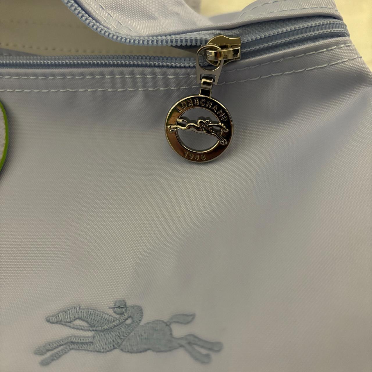 Longchamp le pliage backpack in sky-blue... - Depop