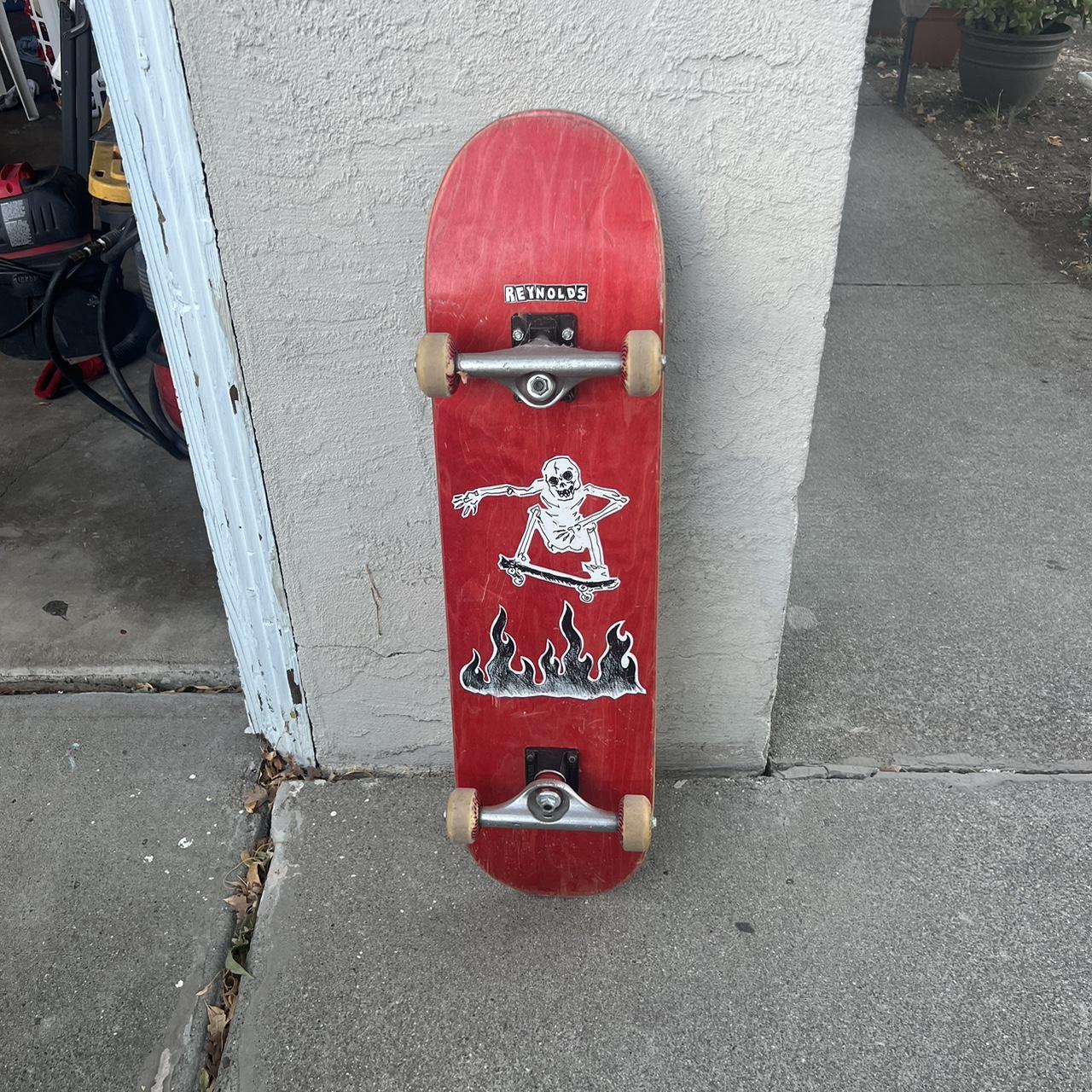 Red and black skateboard #skateboarding - Depop