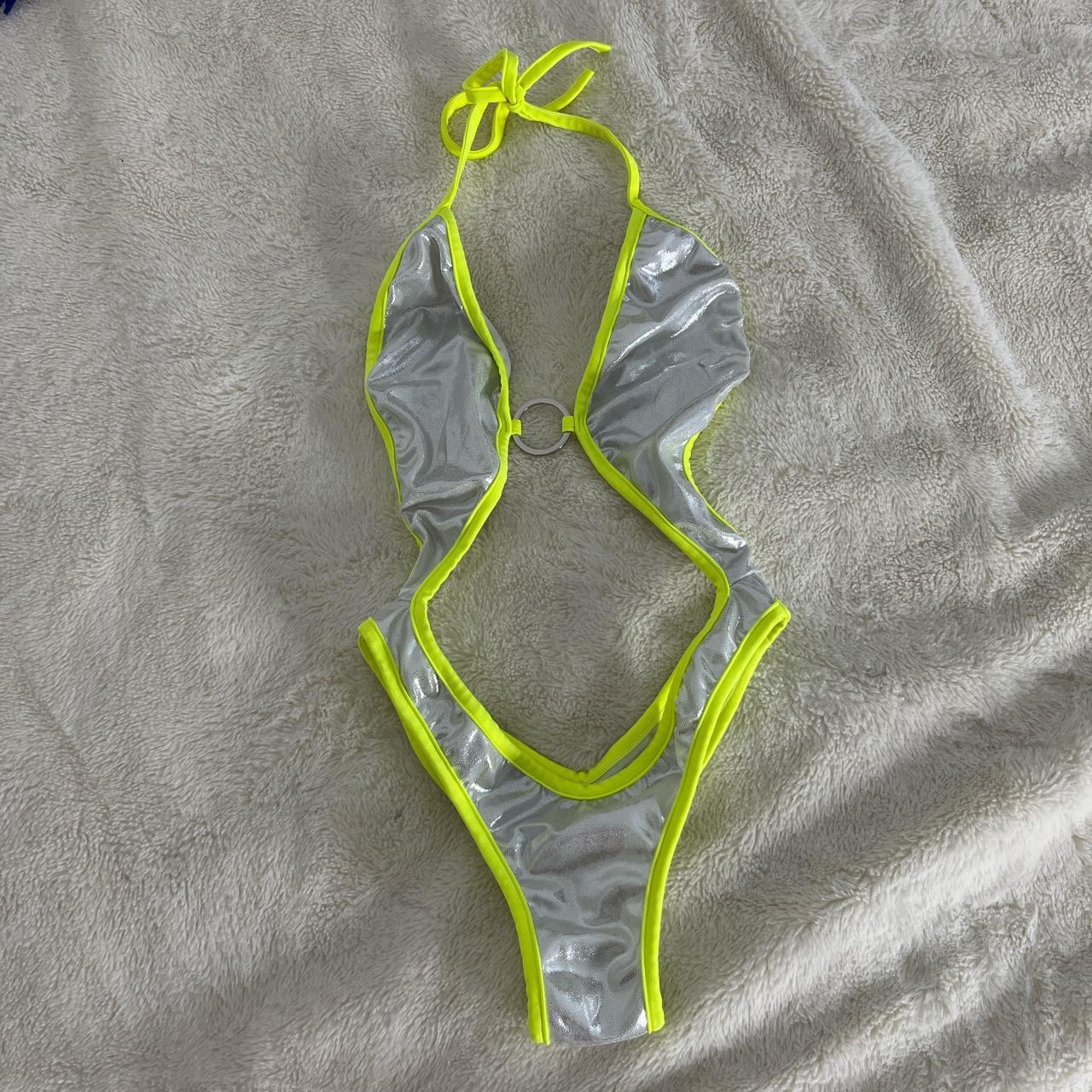 Size small thong one-piece bathing suit with metal... - Depop