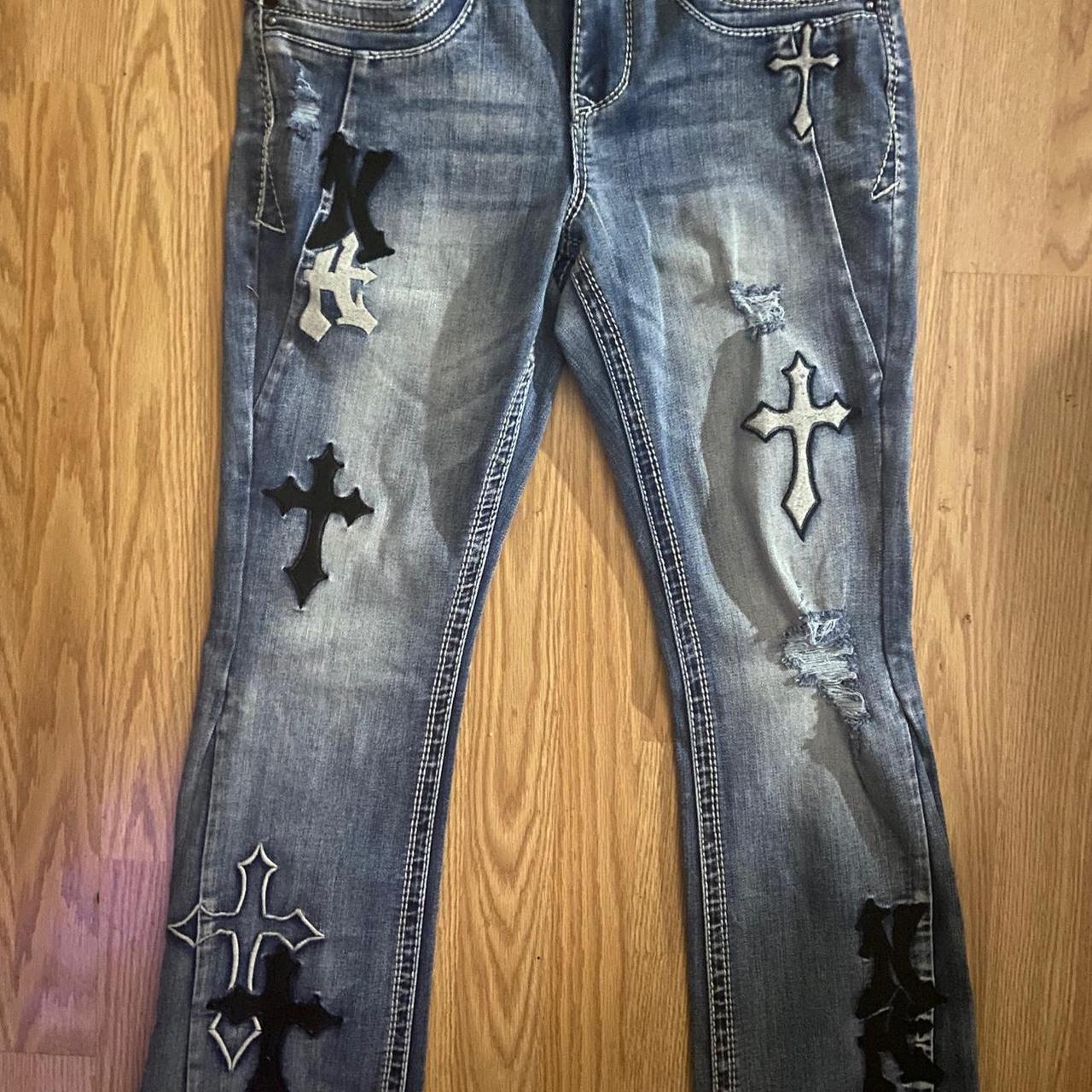 Distressed denim jeans with crosses on the knees... | Depop