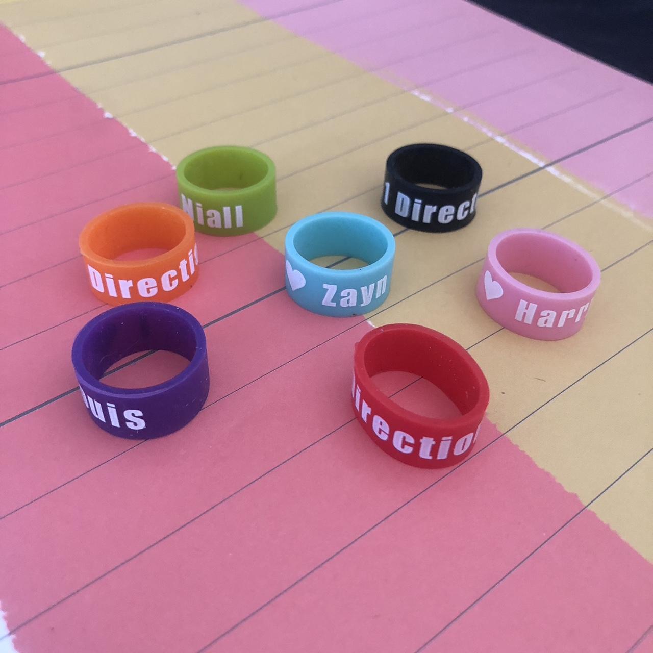 One Direction Rubber rings set. Brand new. Price is... - Depop