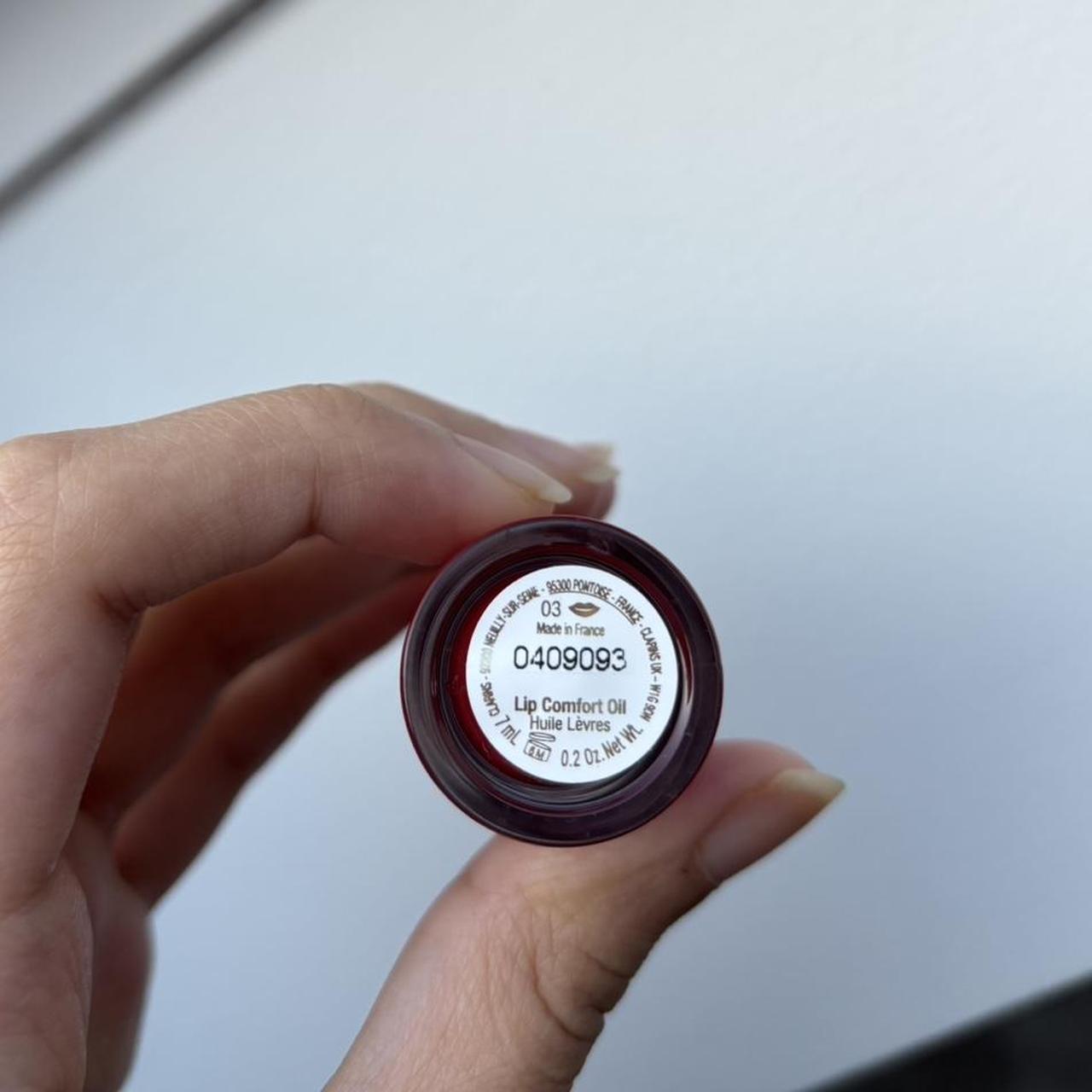 Clarins lip comfort oil in 03 cherry Brand new... | Depop