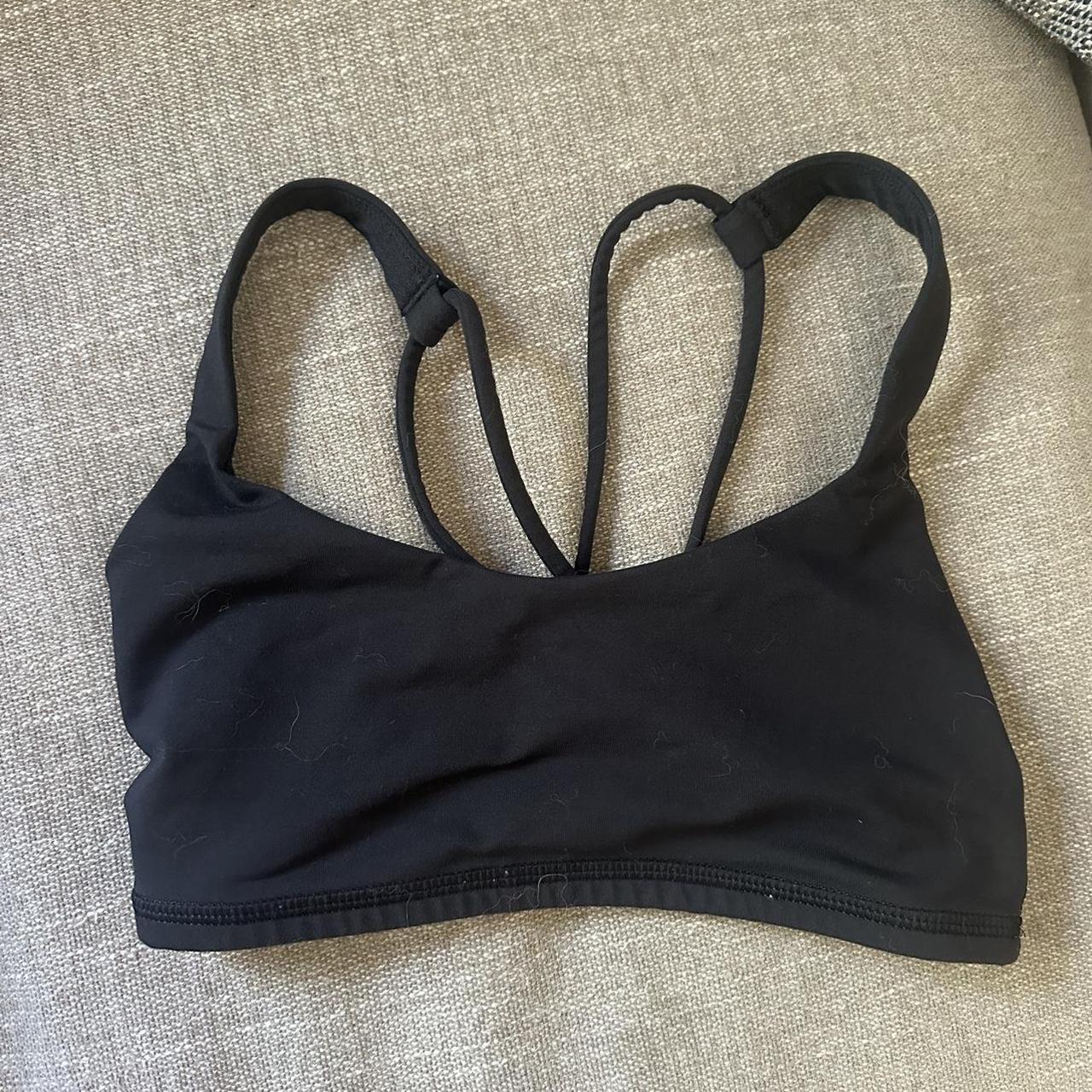 Lululemon black sports bra Too small now - Depop