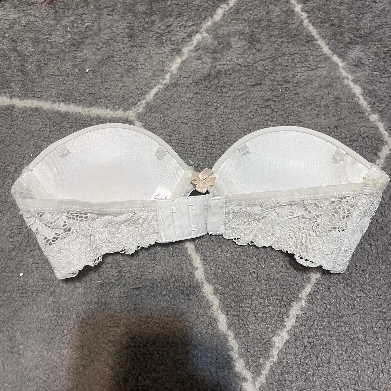 32A white strapless lace bra Shows some signs of... - Depop