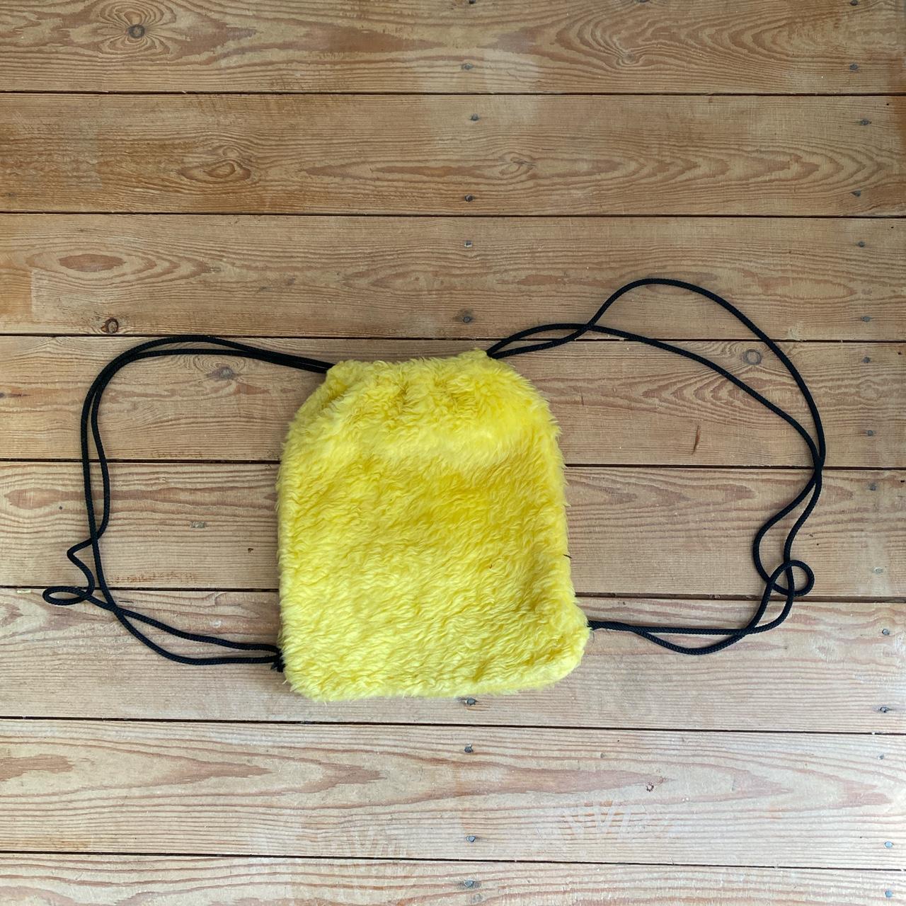 Yellow fluffy mini drawstring backpack perfect for... - Depop