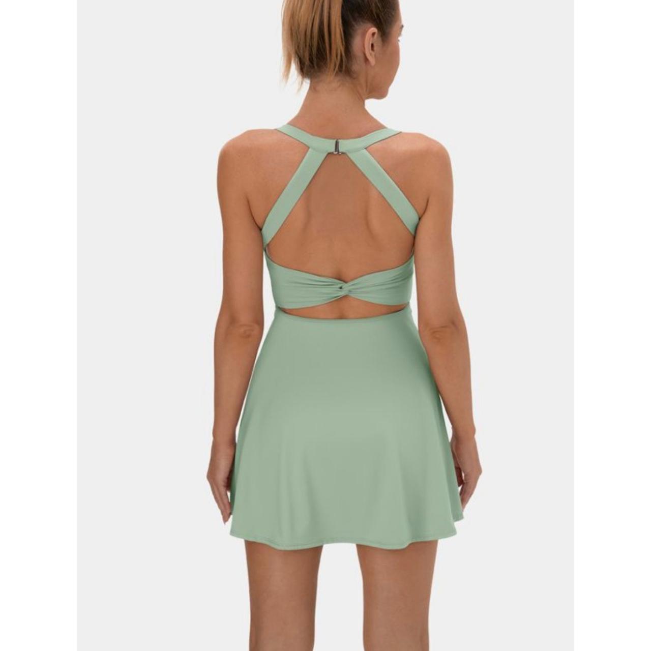 This is a New Halara Backless Cut Out Twisted Dance... - Depop