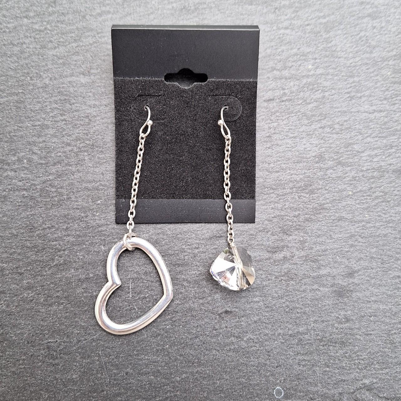 SWAROVSKI heart crystal asymmetric earrings.... - Depop