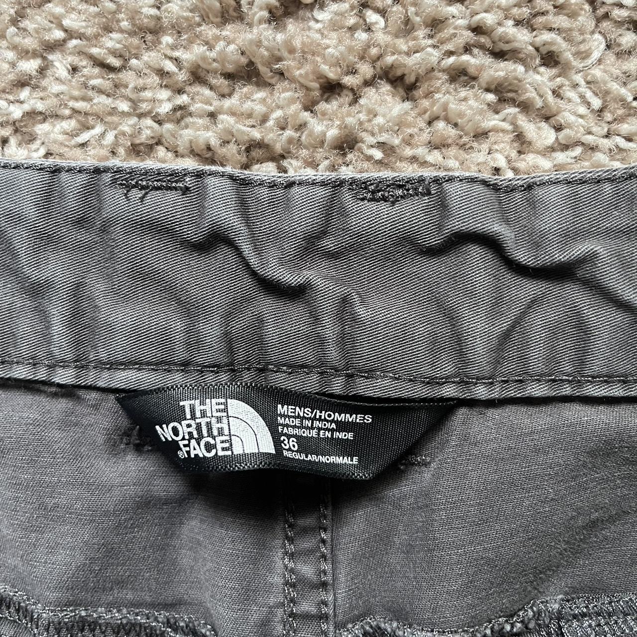 Grey North Face Pants Size 36 Has a small paint... - Depop