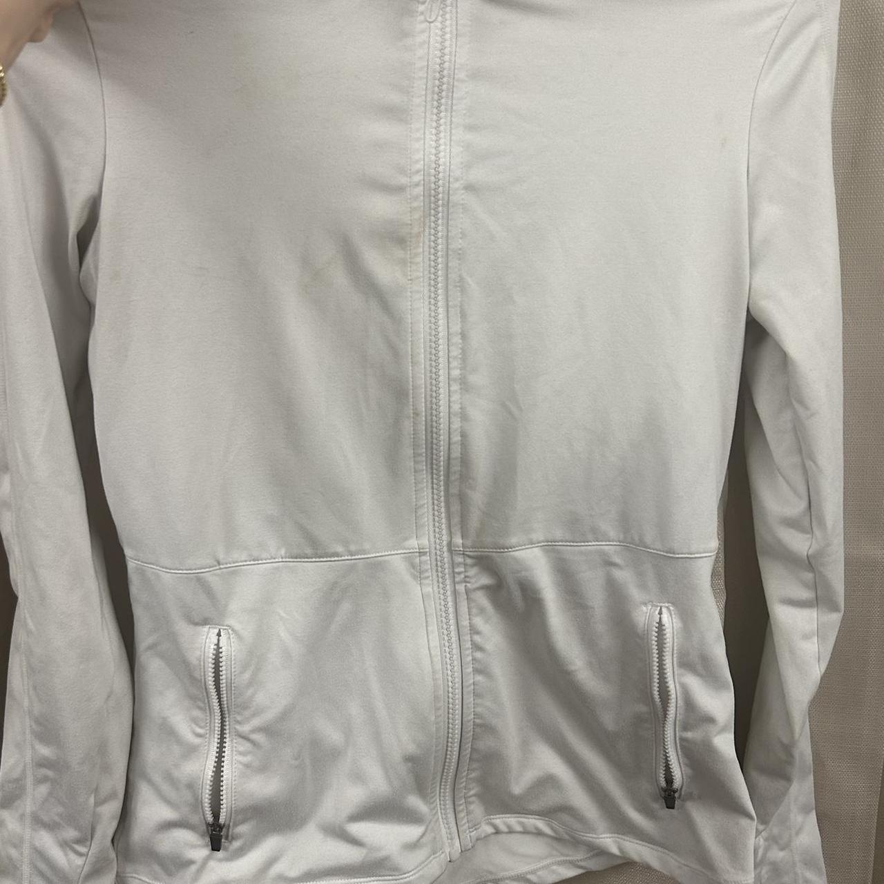 White workout jacket with some light stains. - Depop
