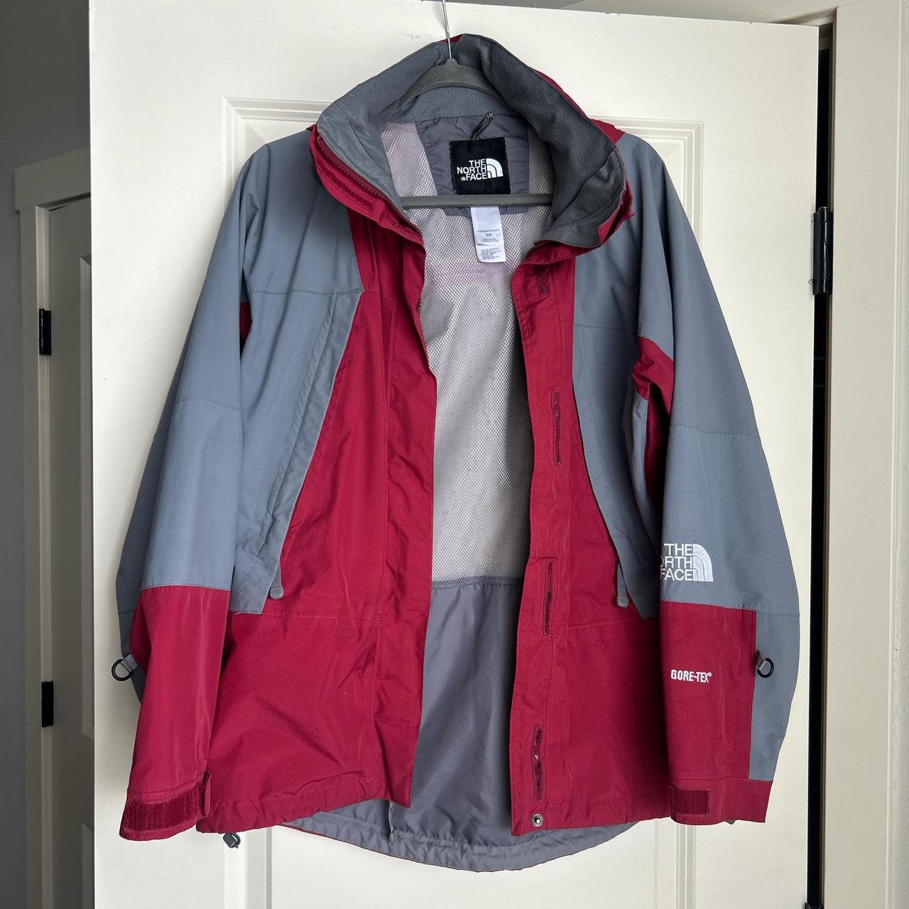 The North Face red and grey rain coat with underarm... | Depop