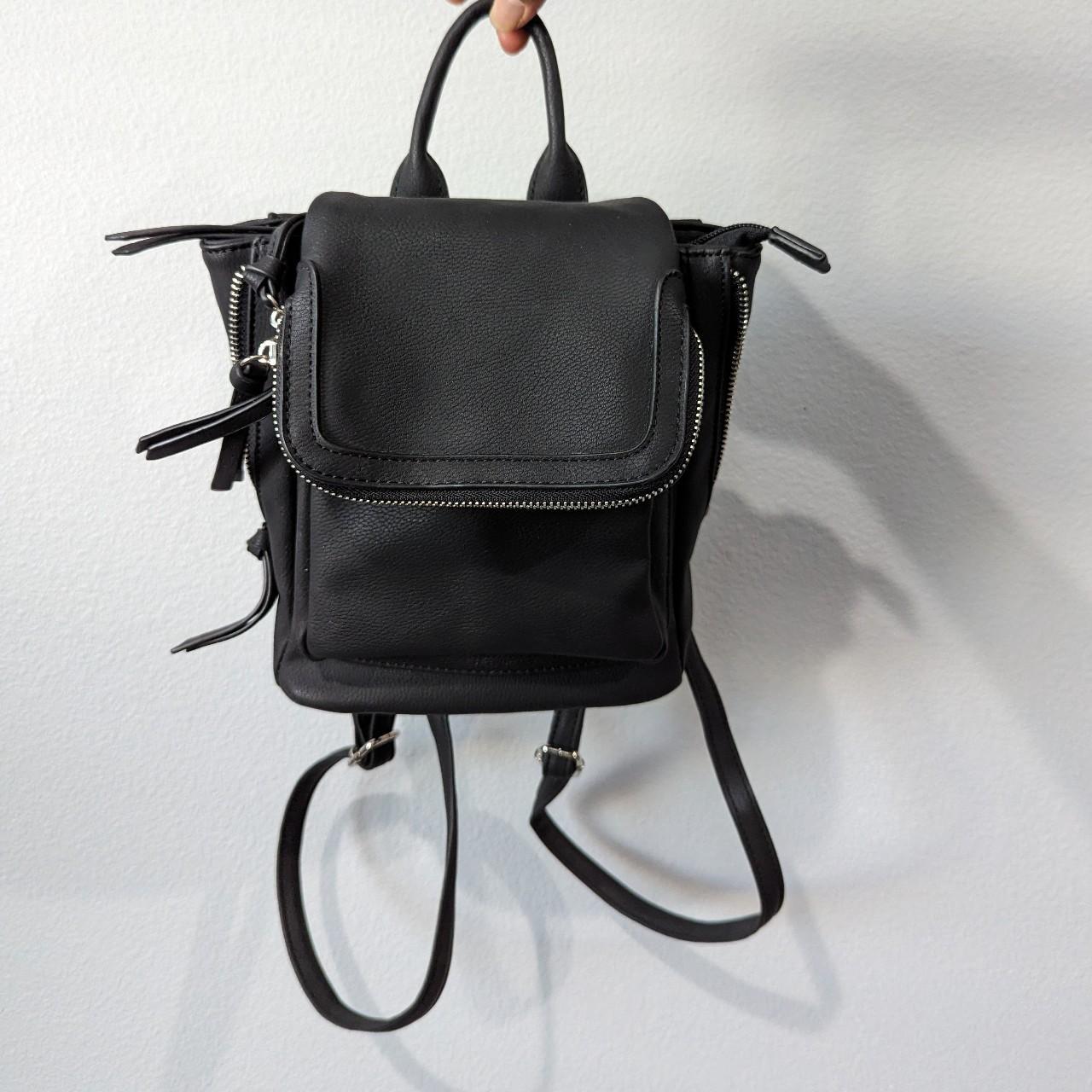 The cutest mini backpack. Has side zippers to... - Depop