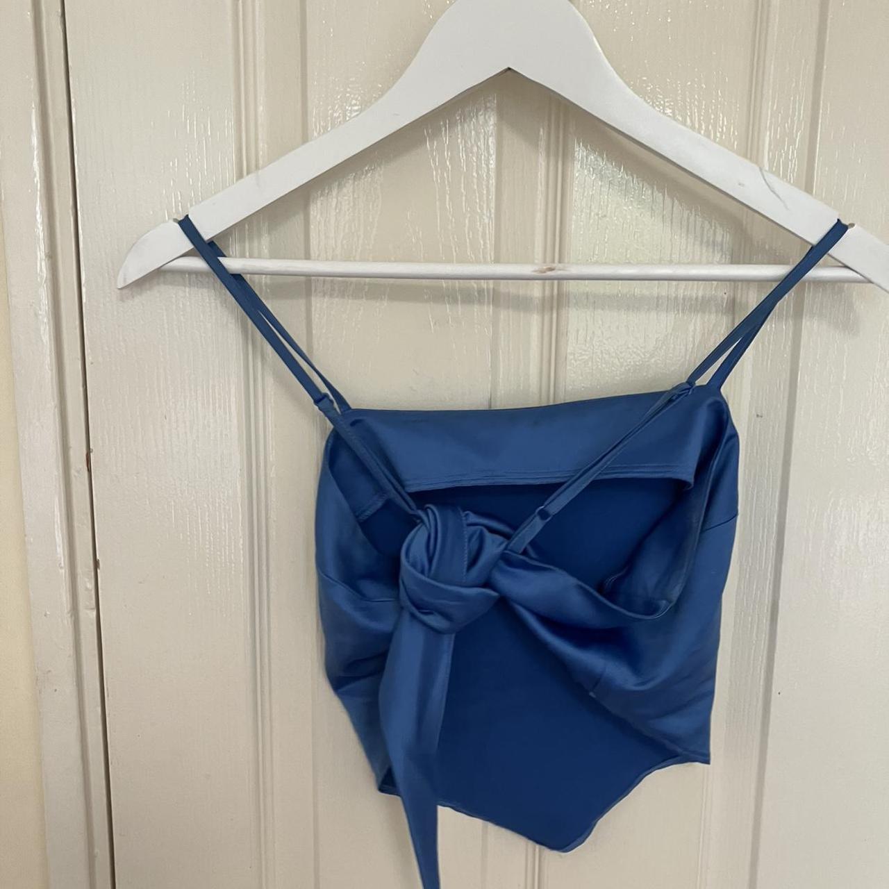 Blue metallic triangle top with tie back from... - Depop
