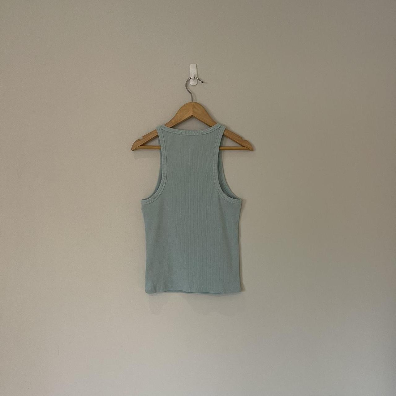 light blue tank top stretchy from Supre label size:... - Depop