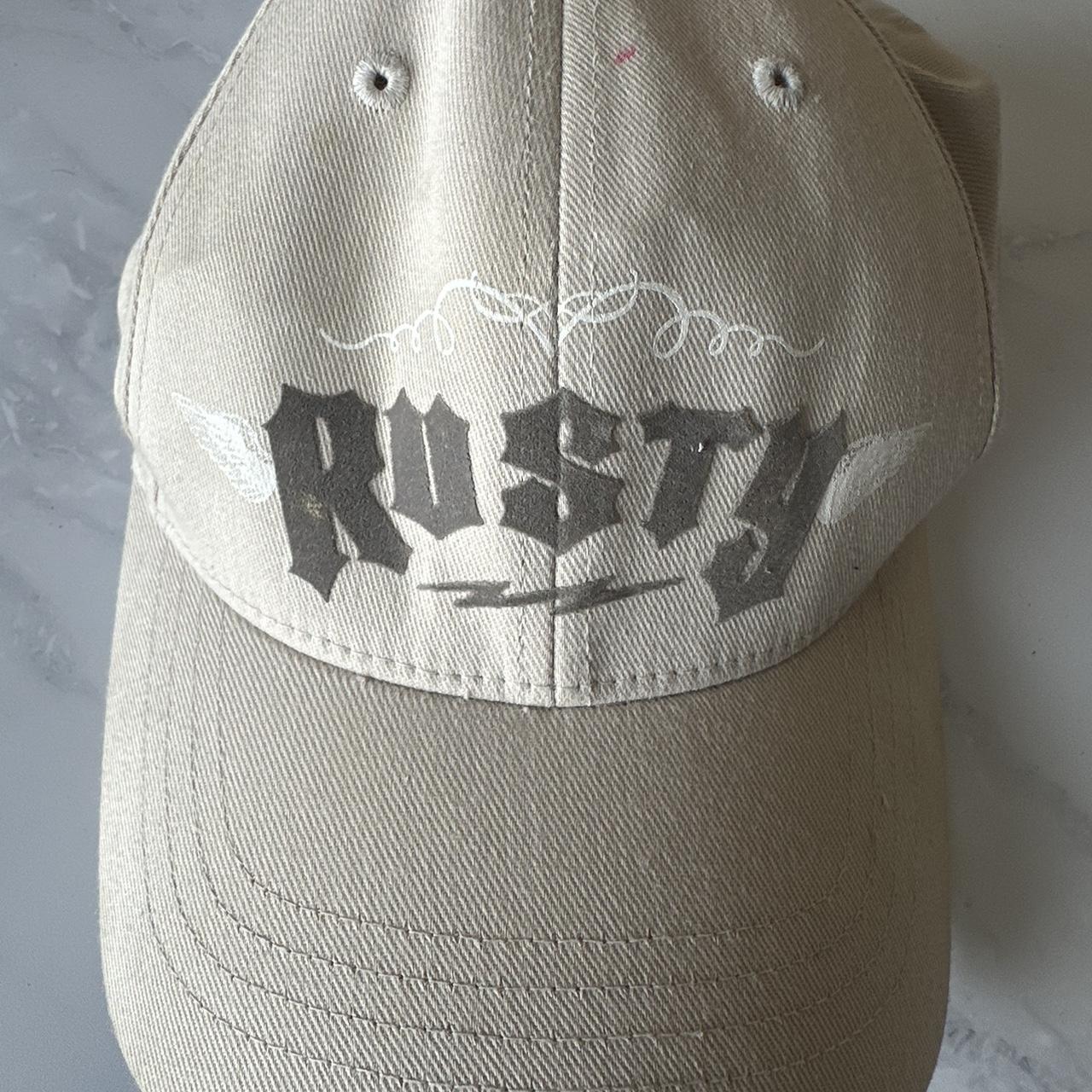 Y2K Rusty cap in cream with grey logo on the front... - Depop