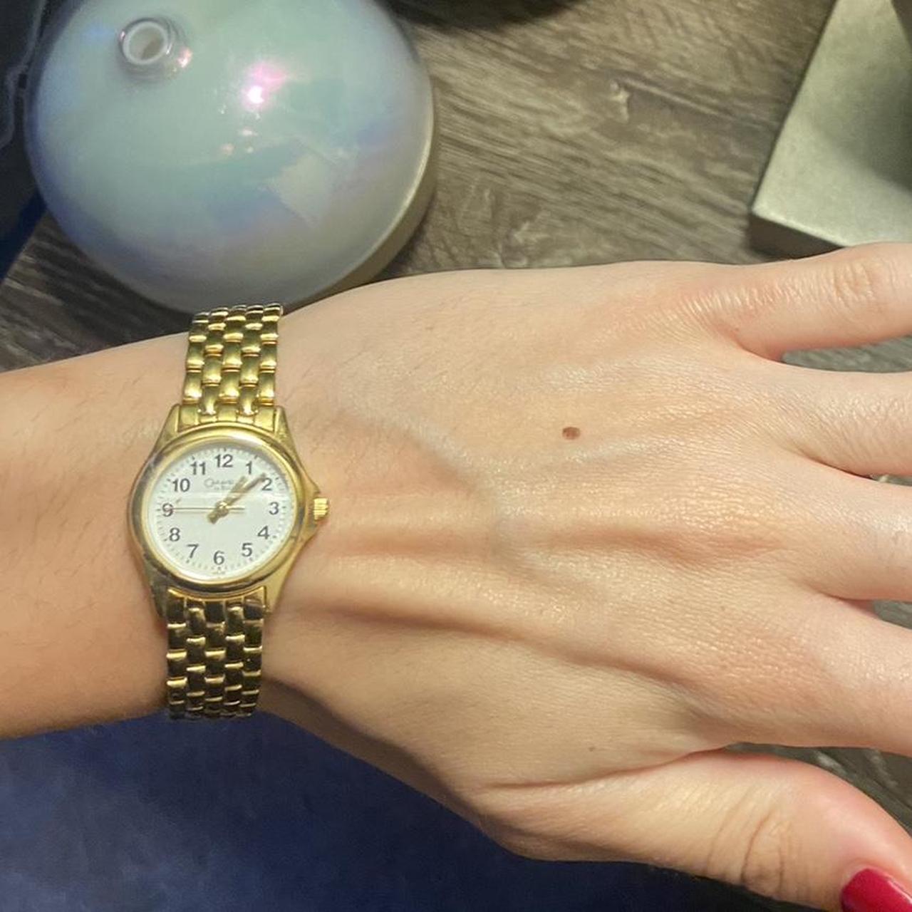 Gold tone women's watch with white face... - Depop