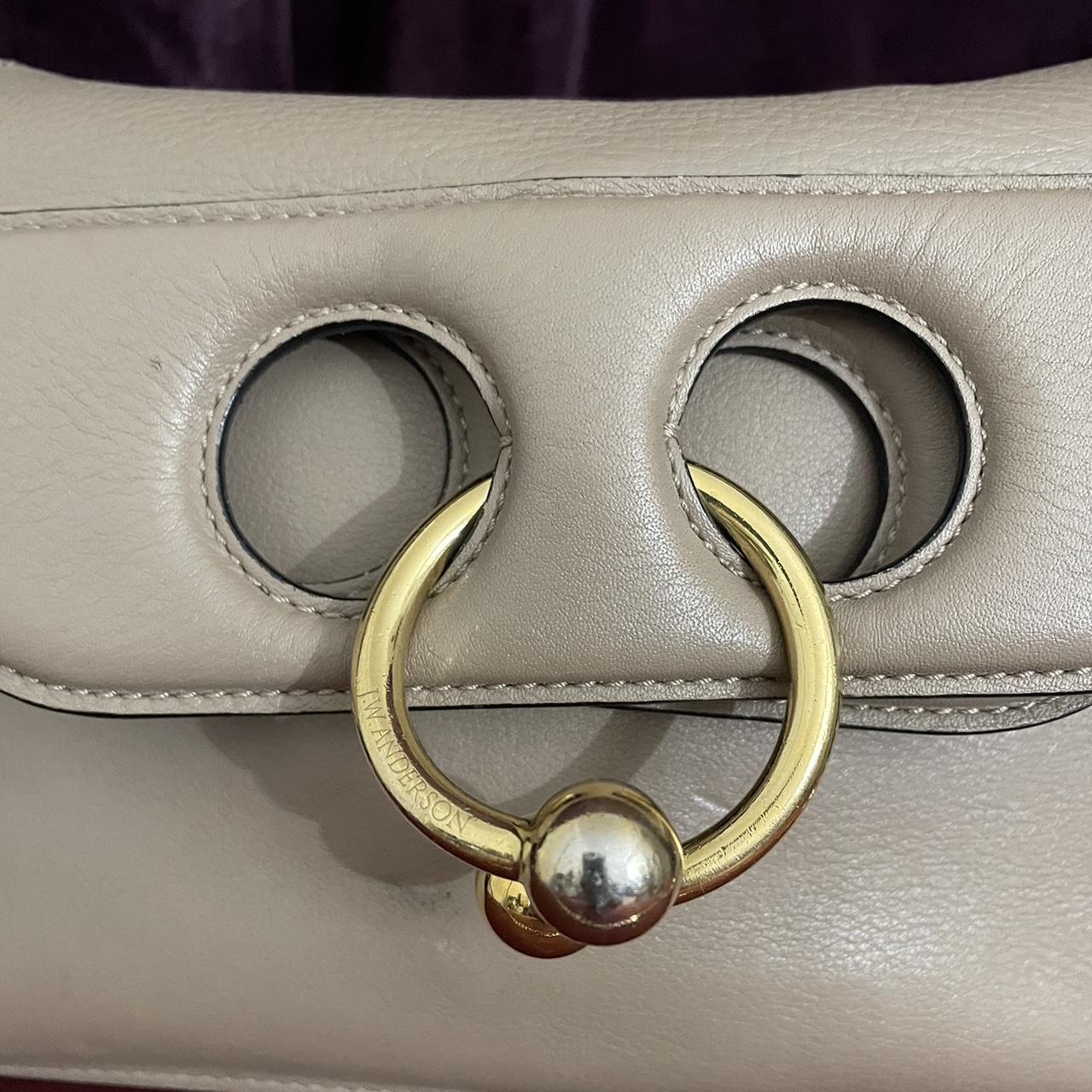 J W Anderson piercing bag. 15 x 21 cm. Mark below... - Depop