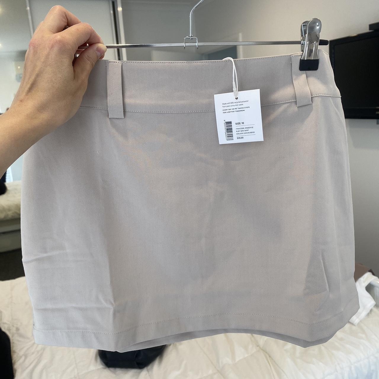 Supre low rise beige mini skirt. New with tags. Size... - Depop