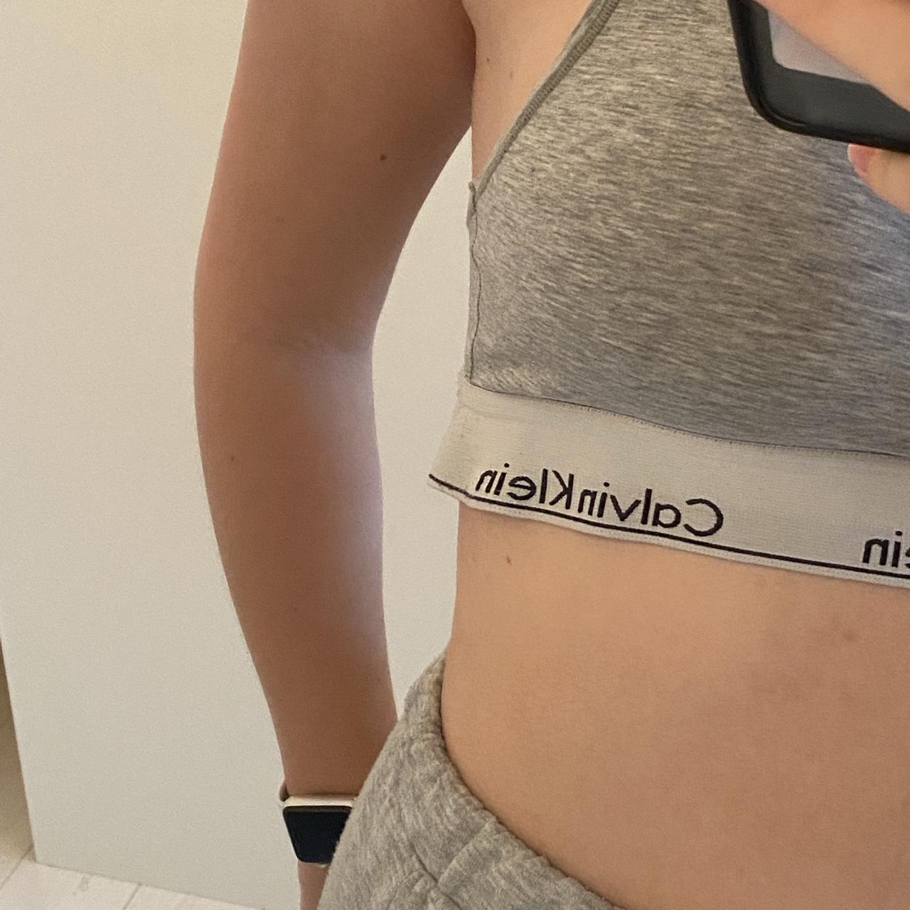 Calvin Klein grey bralet Size medium Worn a lot so... - Depop