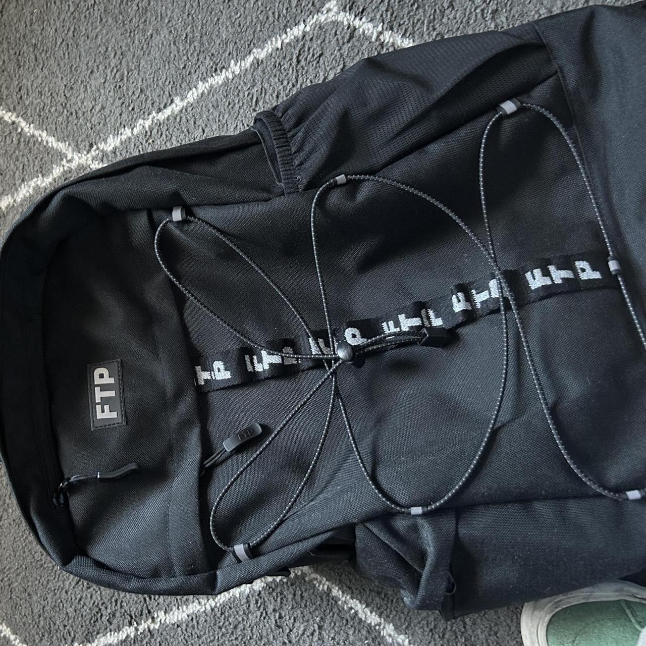 Black FTP backpack with adjustable straps and... | Depop