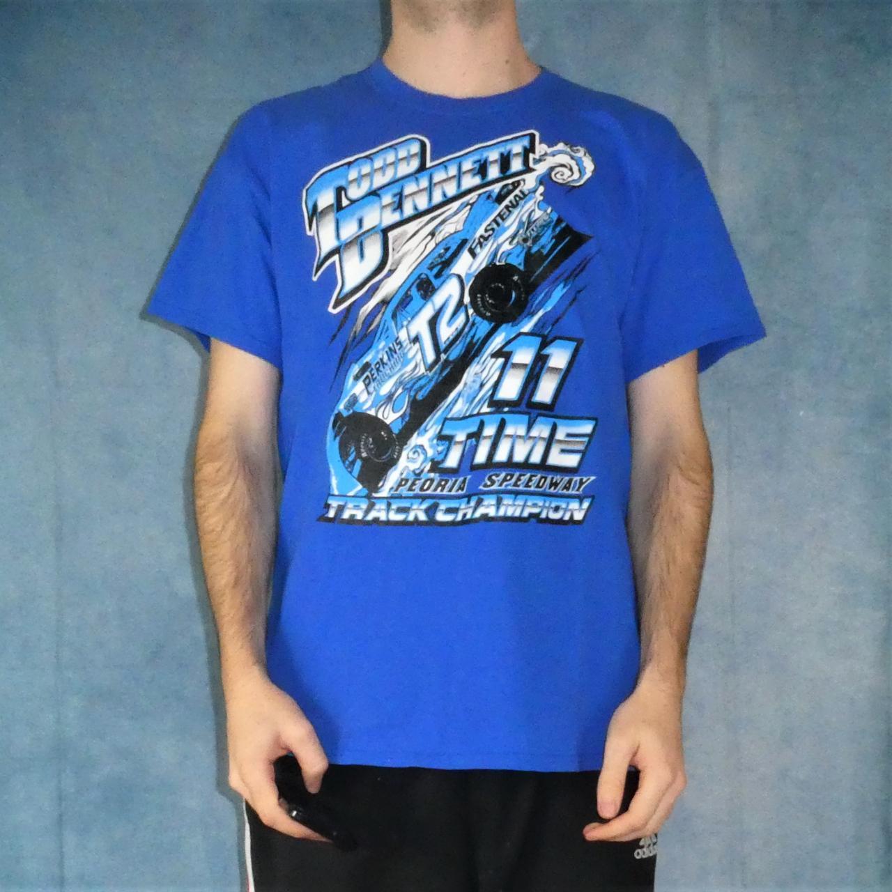 Large blue motorsport graphic t-shirt 21.5" pit to... - Depop