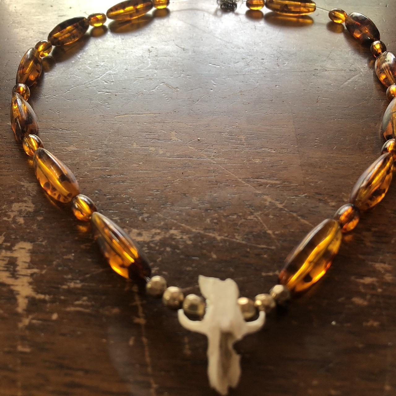 Brown and cream beaded necklace with real vermin... | Depop