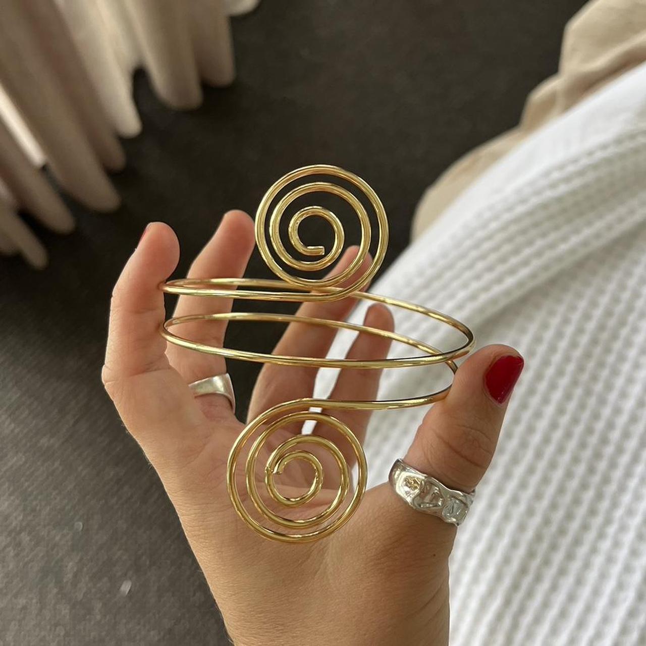 Gold swirly arm cuff bangle 🫶🏼 Thicker gold version &... - Depop