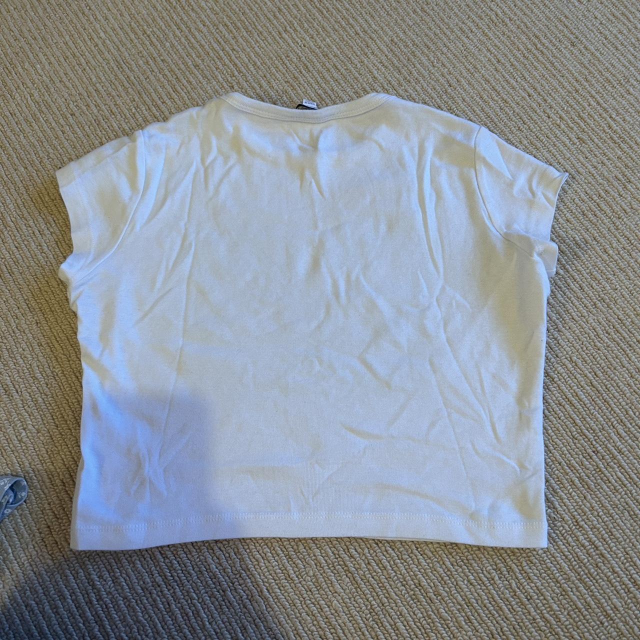 White subdued top with green print of face, so cute... - Depop