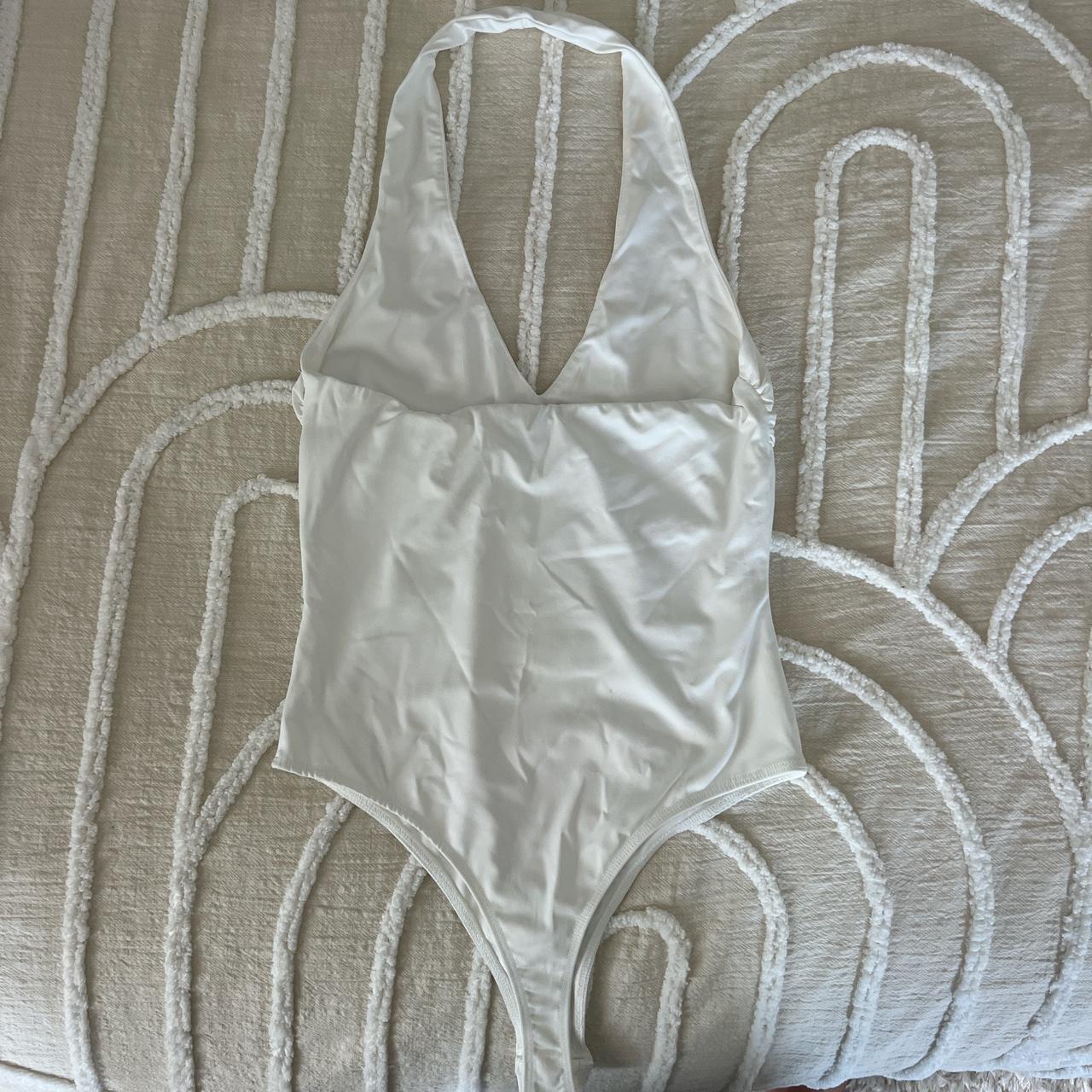 White halter neck body suit Only worn... - Depop