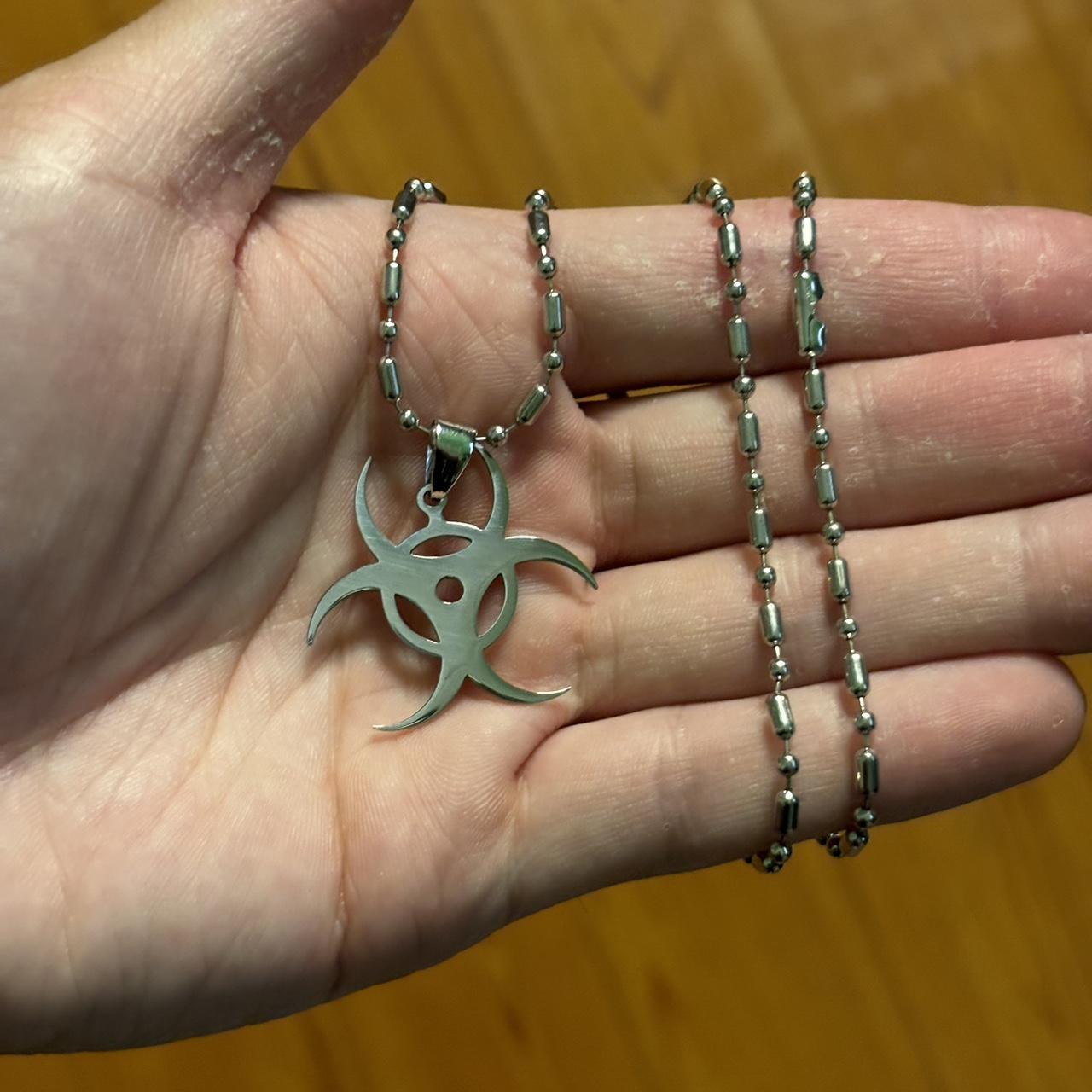 0255 - Silver Biohazard Necklace FREE SHIPPING WHEN... | Depop