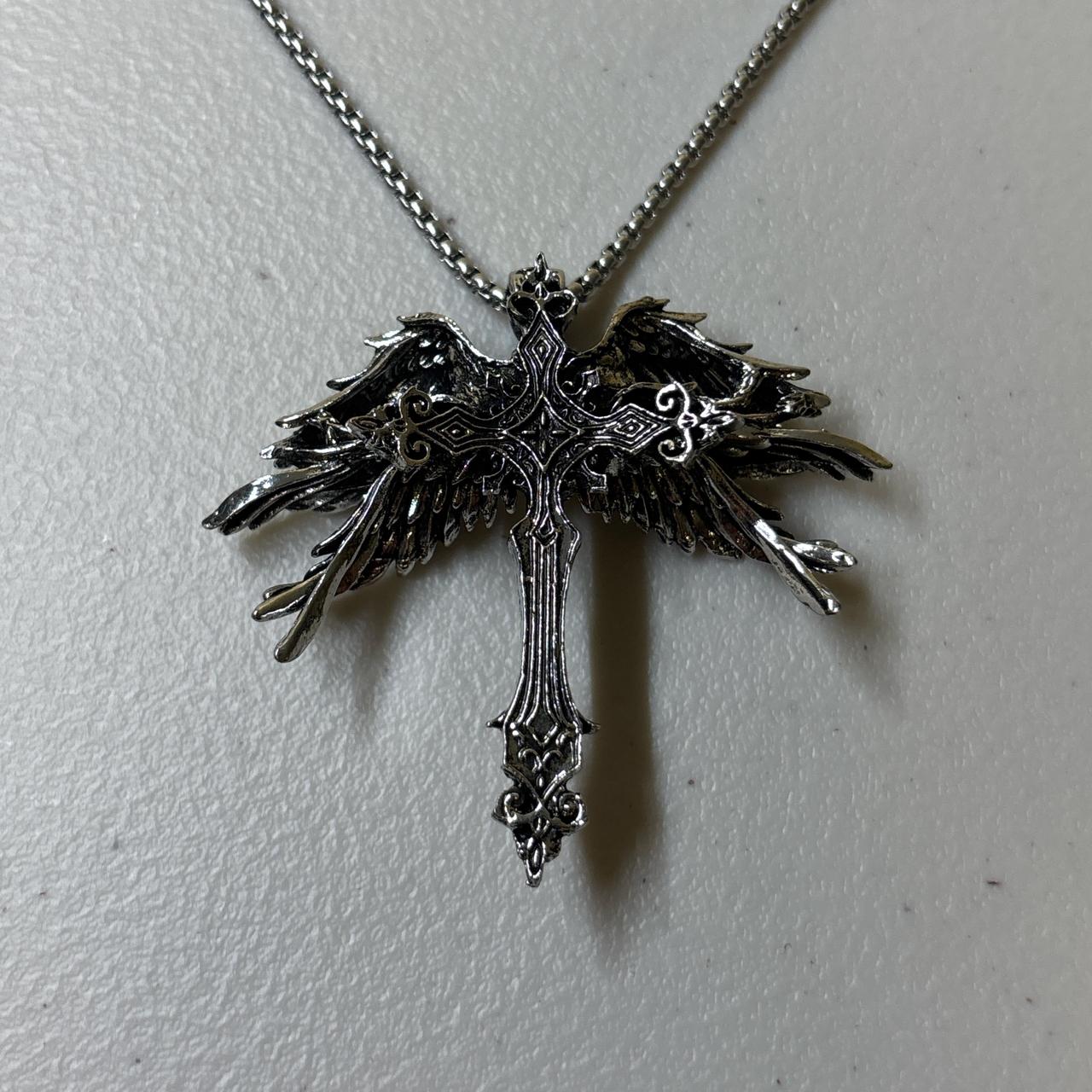 0646 - Angel Multi Wings Cross... | Depop