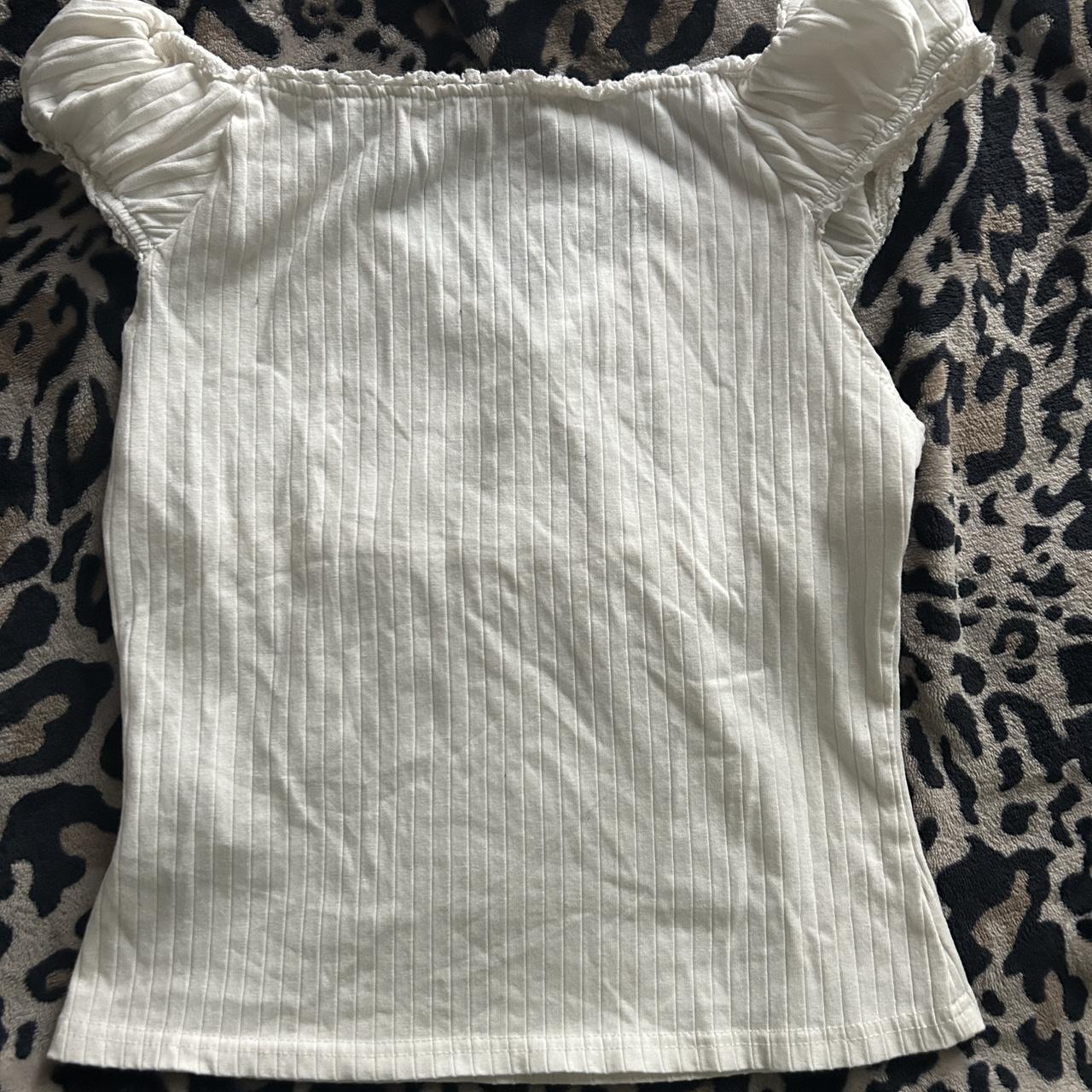 White coquette top with a cute detail on the front... - Depop