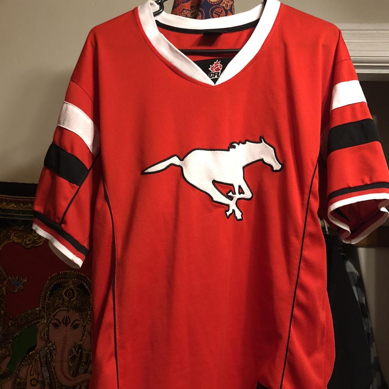 red football jersey (Calgary Stampeders)... - Depop