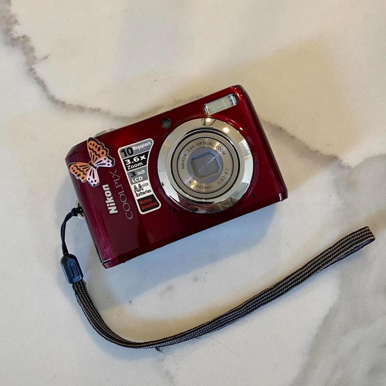 Cute lil red Nikon Coolpix L20 point and shoot... - Depop
