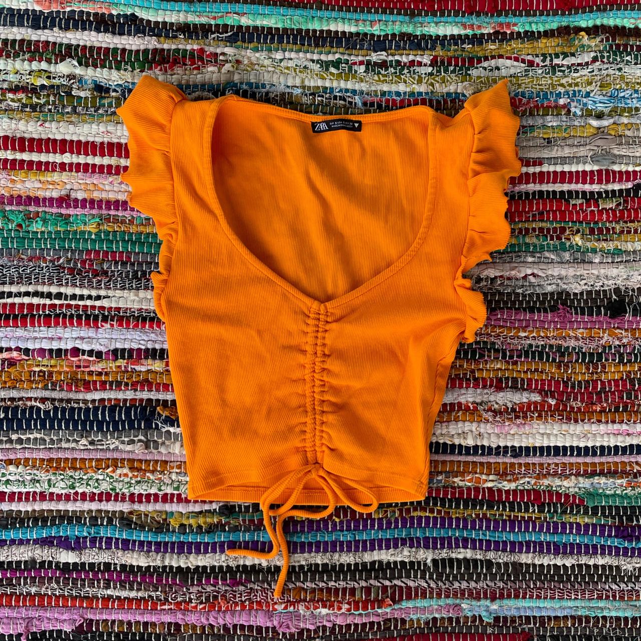 Orange crop top with ruffled sleeves. Size small... - Depop