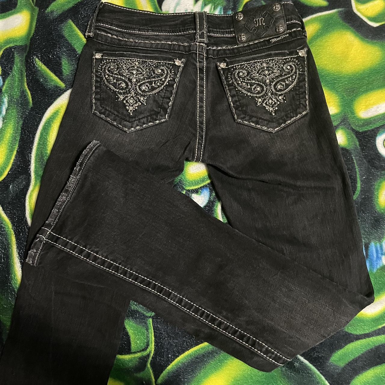 black miss me jeans with rhinestone design on the... - Depop