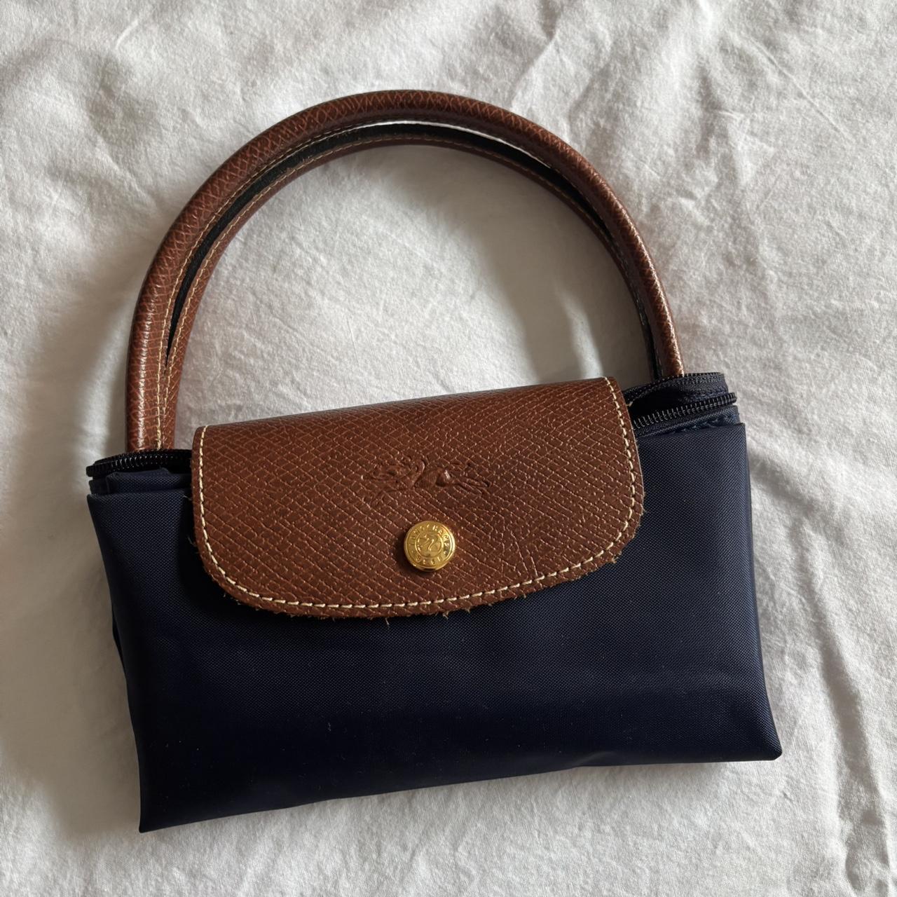 Longchamp small navy bag with brown details barely... - Depop