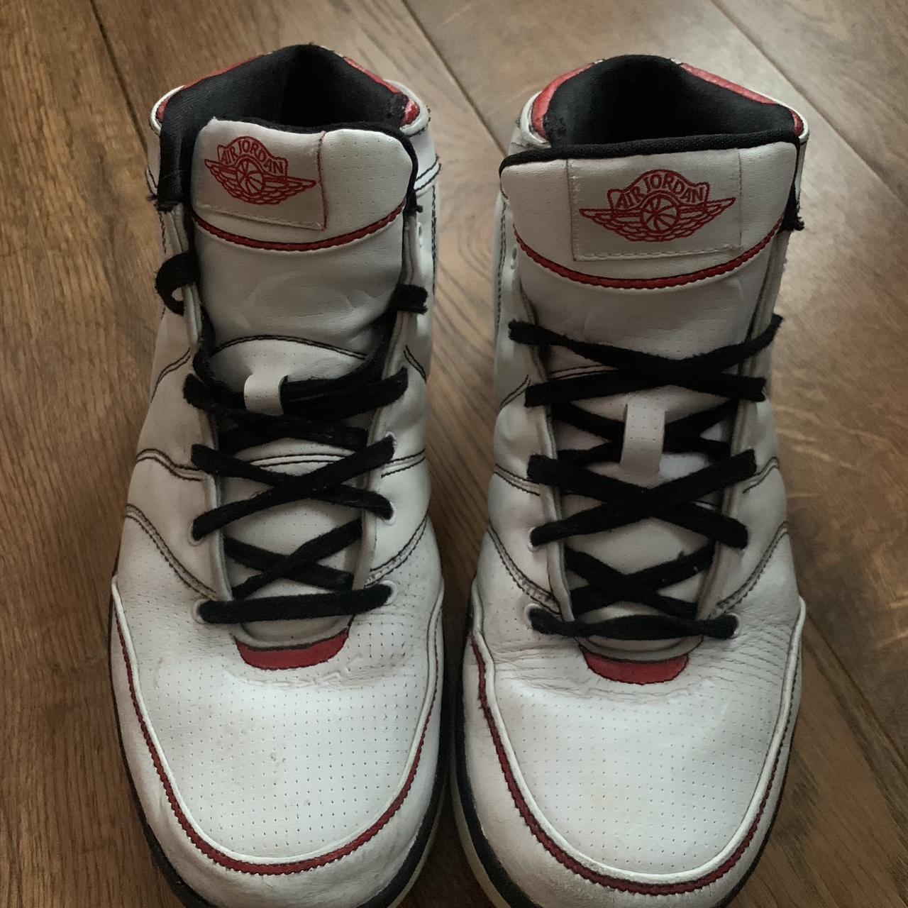 White air jordan mids with black stitching and red... - Depop