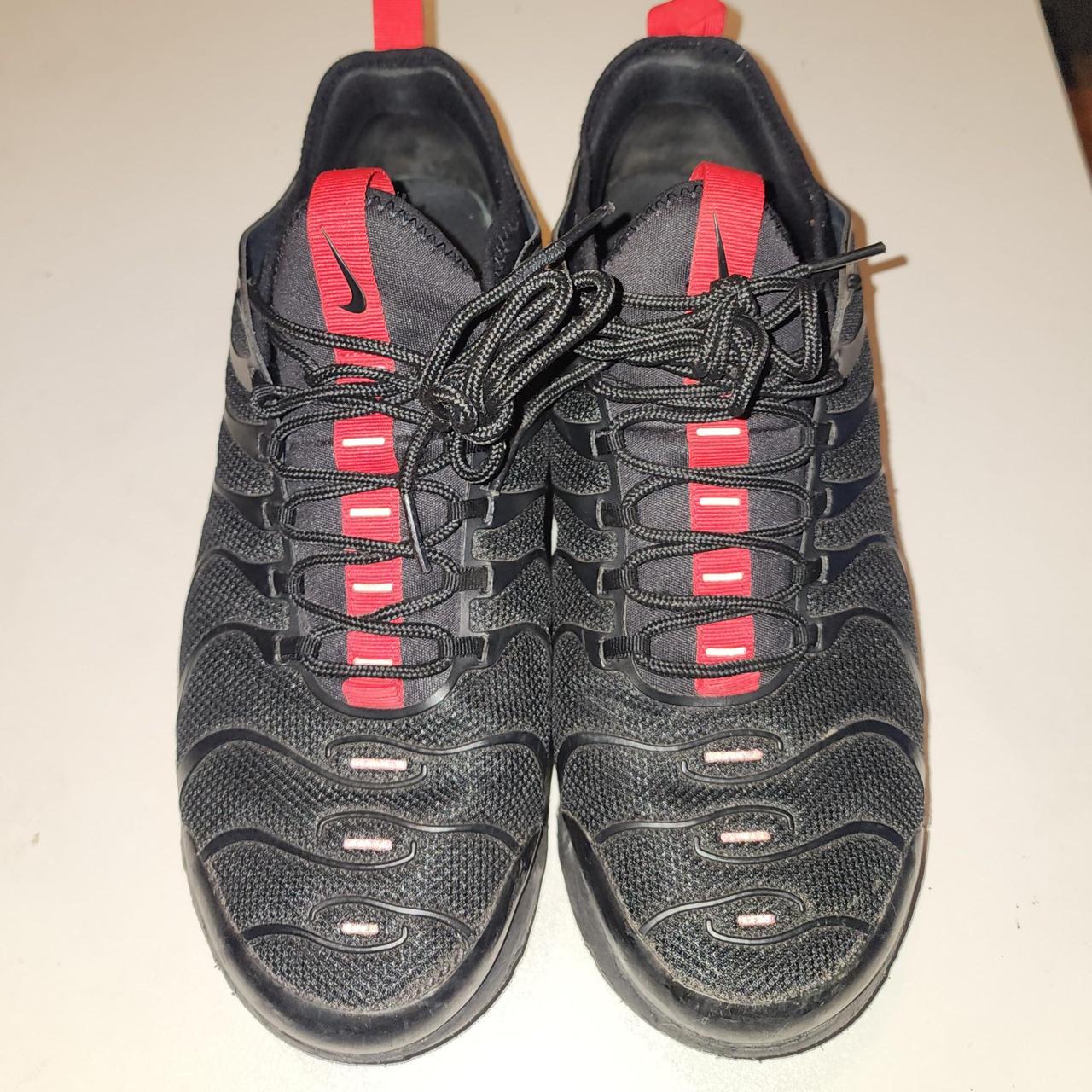 Black and red Nike Air Max Plus TN trainers. A... | Depop