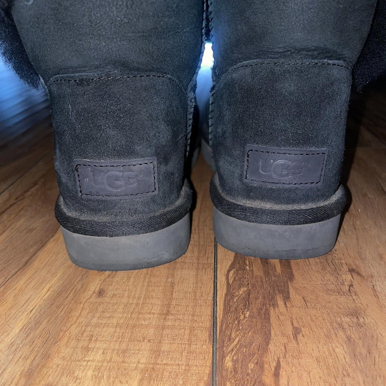Black mini uggs with button on the side good... - Depop