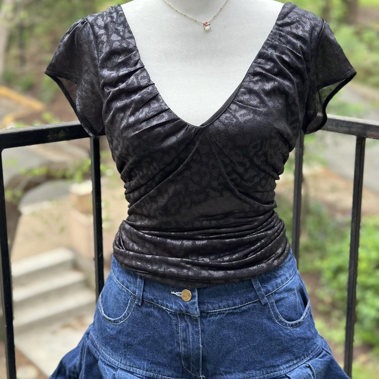 ♡black metallic top with ruched sides and a v... | Depop