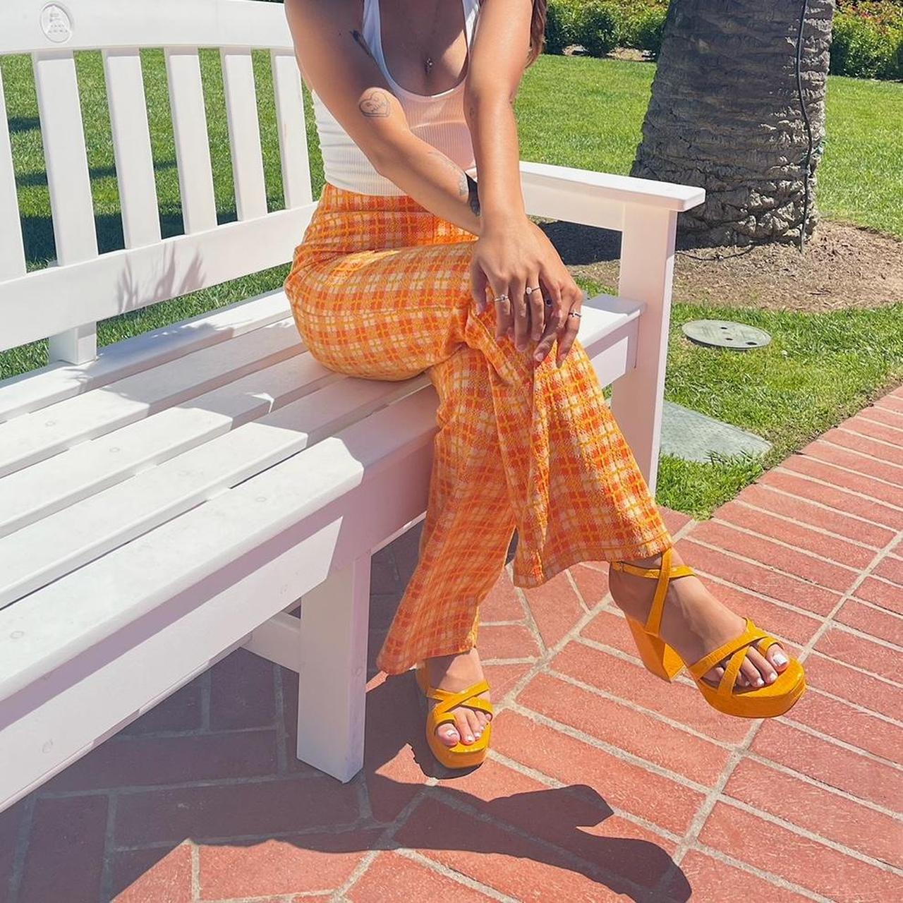 Urban Outfitters Orange multi colored flare pants,... - Depop