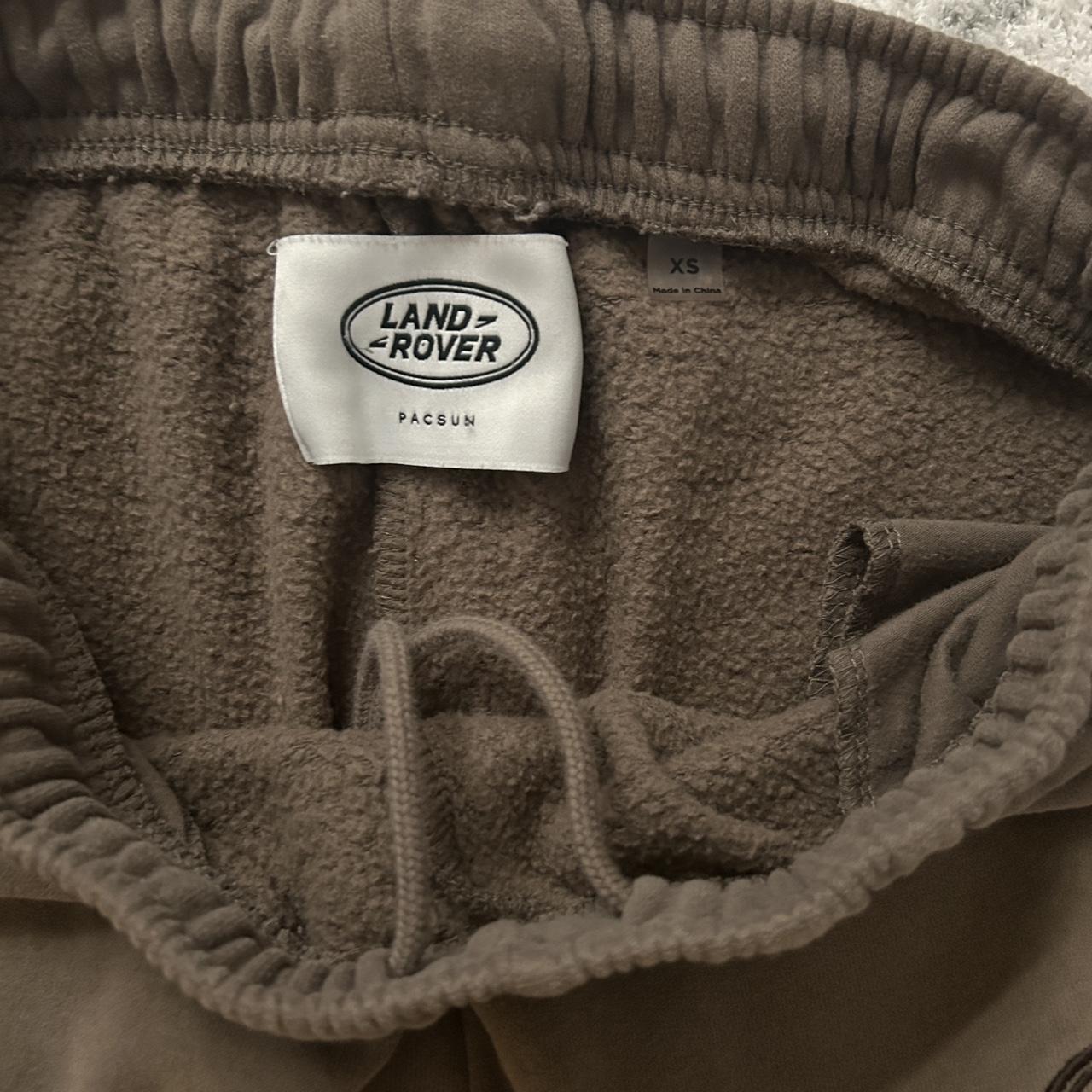 BROWN LAND ROVER SWEATPANTS FROM PACSUN. SIZE EXTRA... - Depop