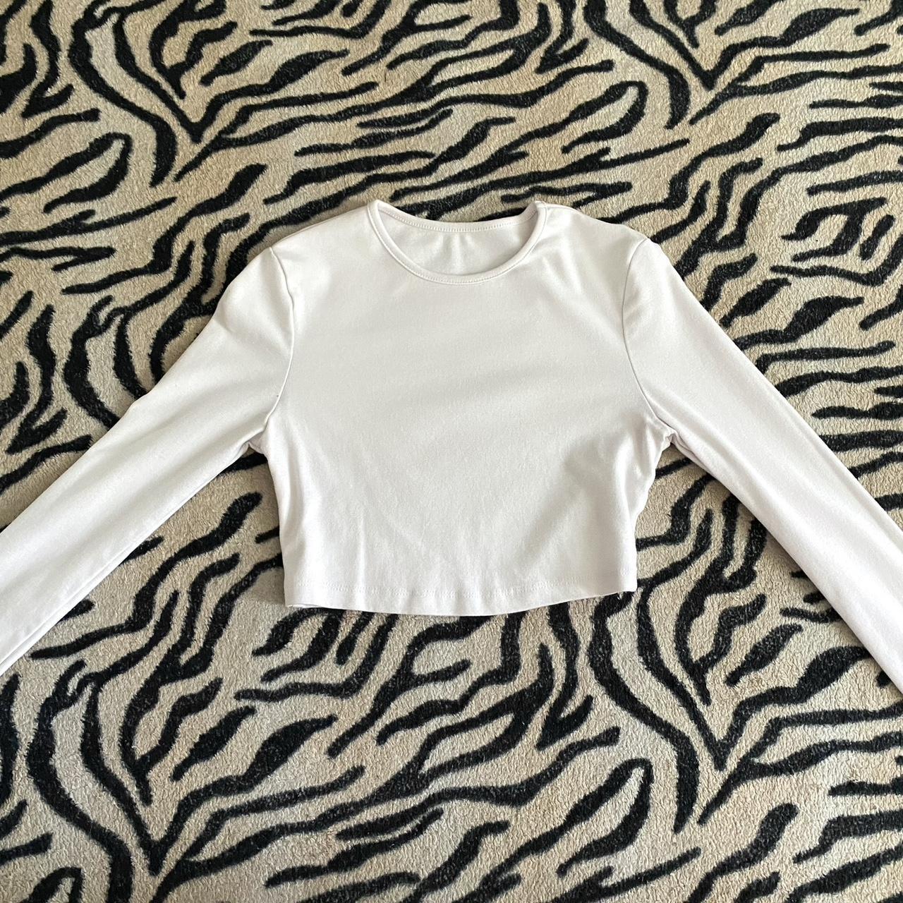 white cropped long sleeve -size s -message me if... - Depop
