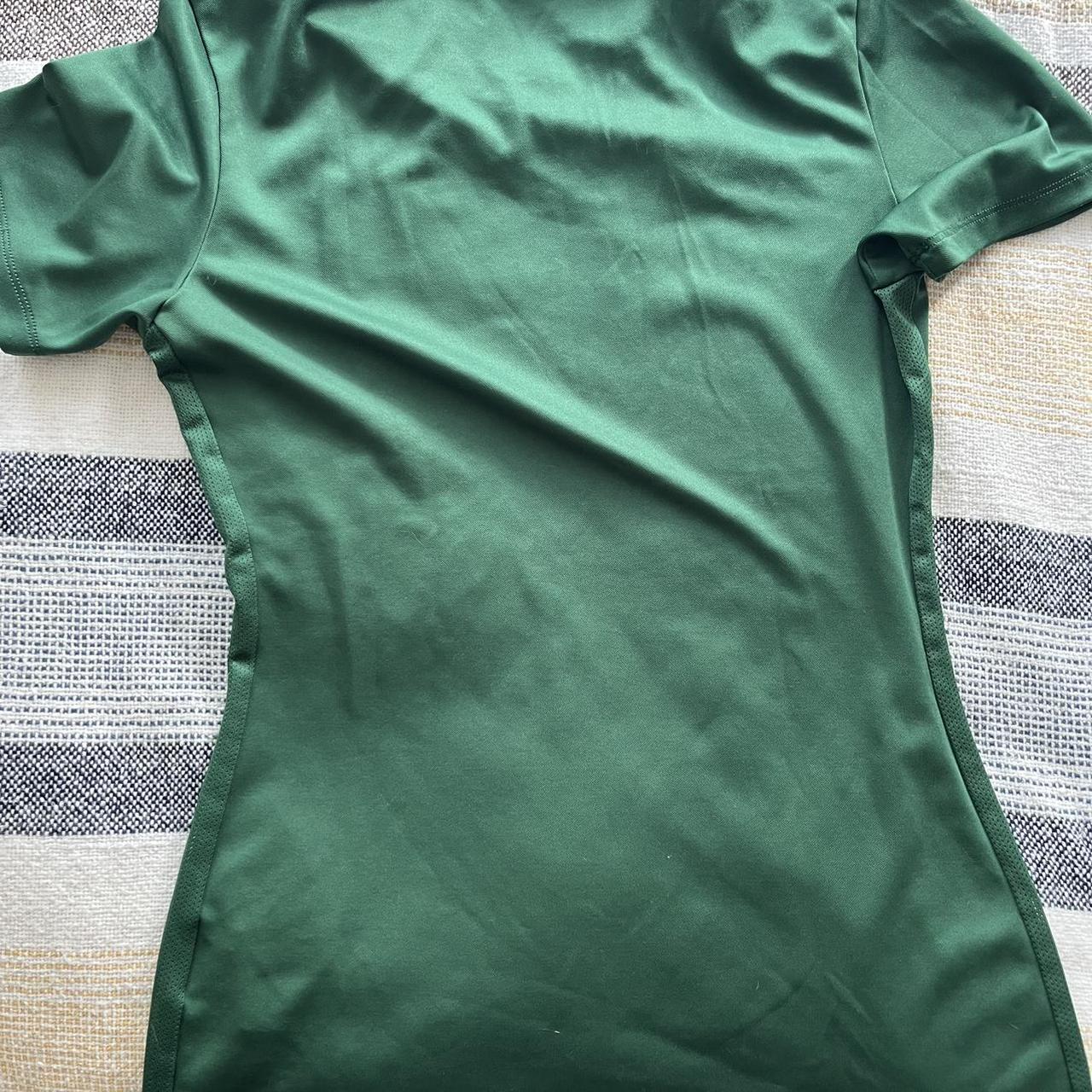 Green running T-shirt from Nike, with V-neck.... - Depop