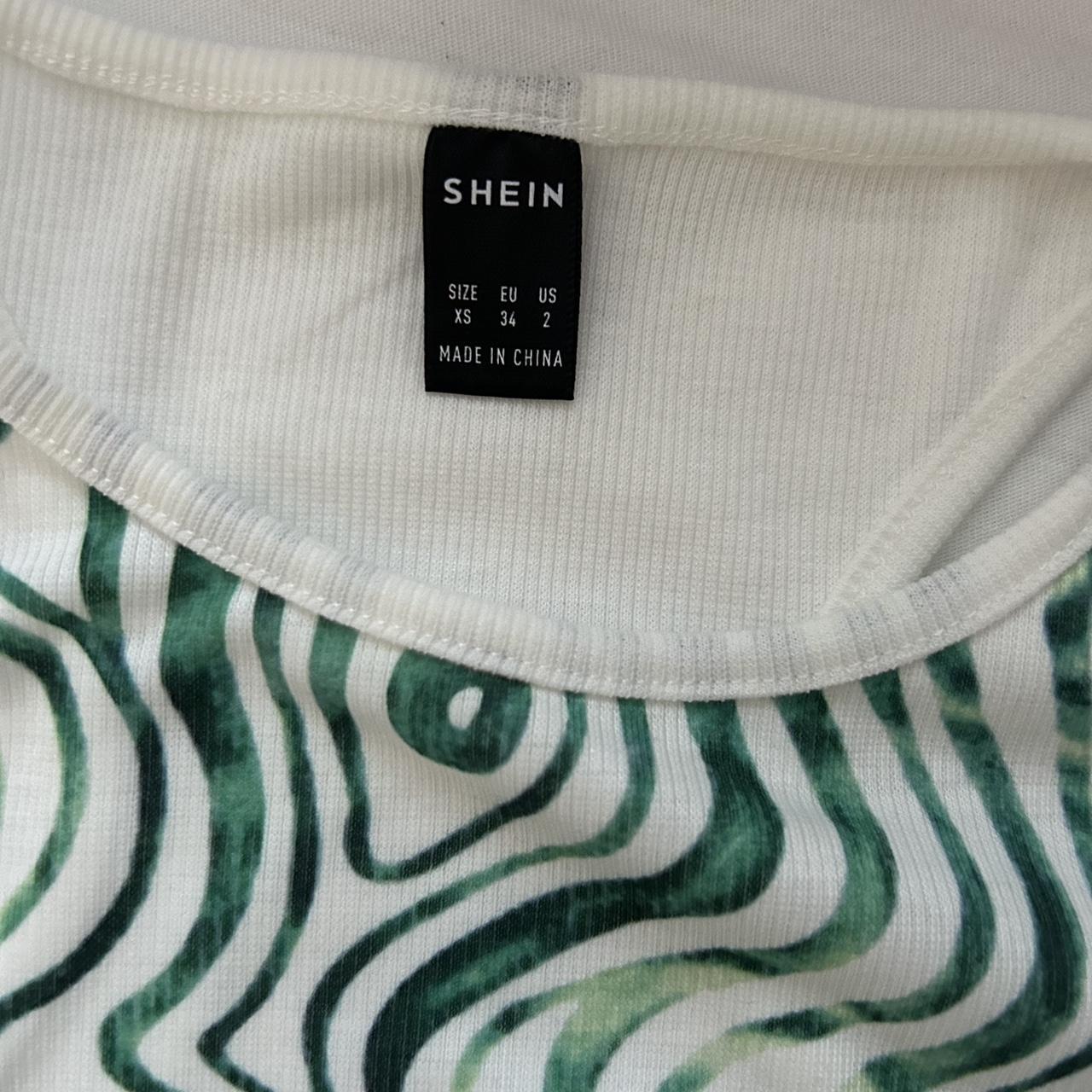 Ribbed white tank with green swirls. Fits XS/S... - Depop