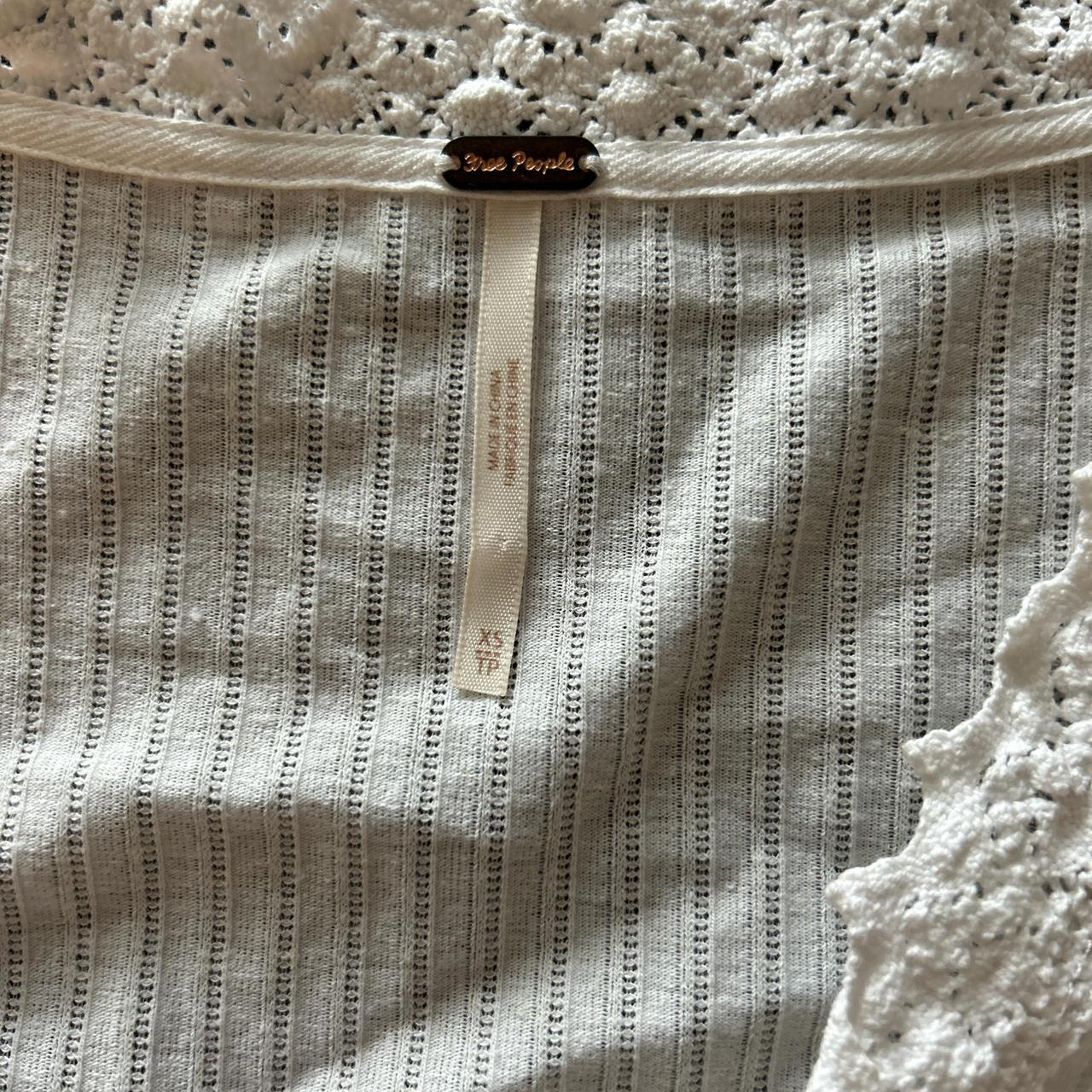 Free people low cut white top with lace buttons and... - Depop