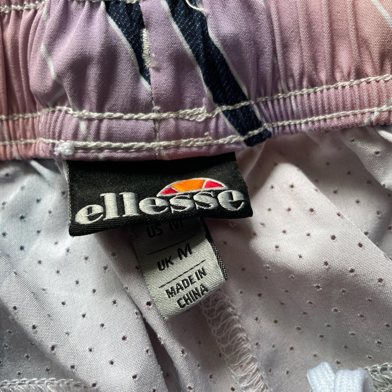 Brand new Ellesse purple/orange sports tennis shorts... - Depop